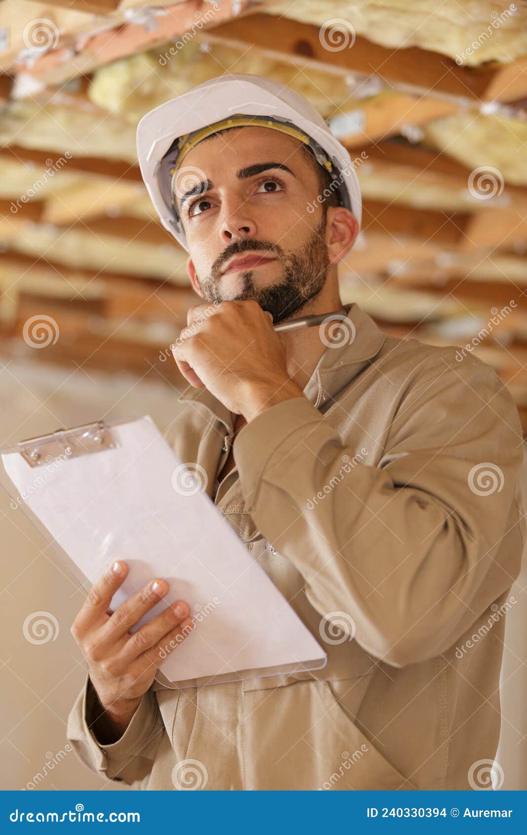 Builder Thinking about Something while Holding Clipboard Stock Photo ...
