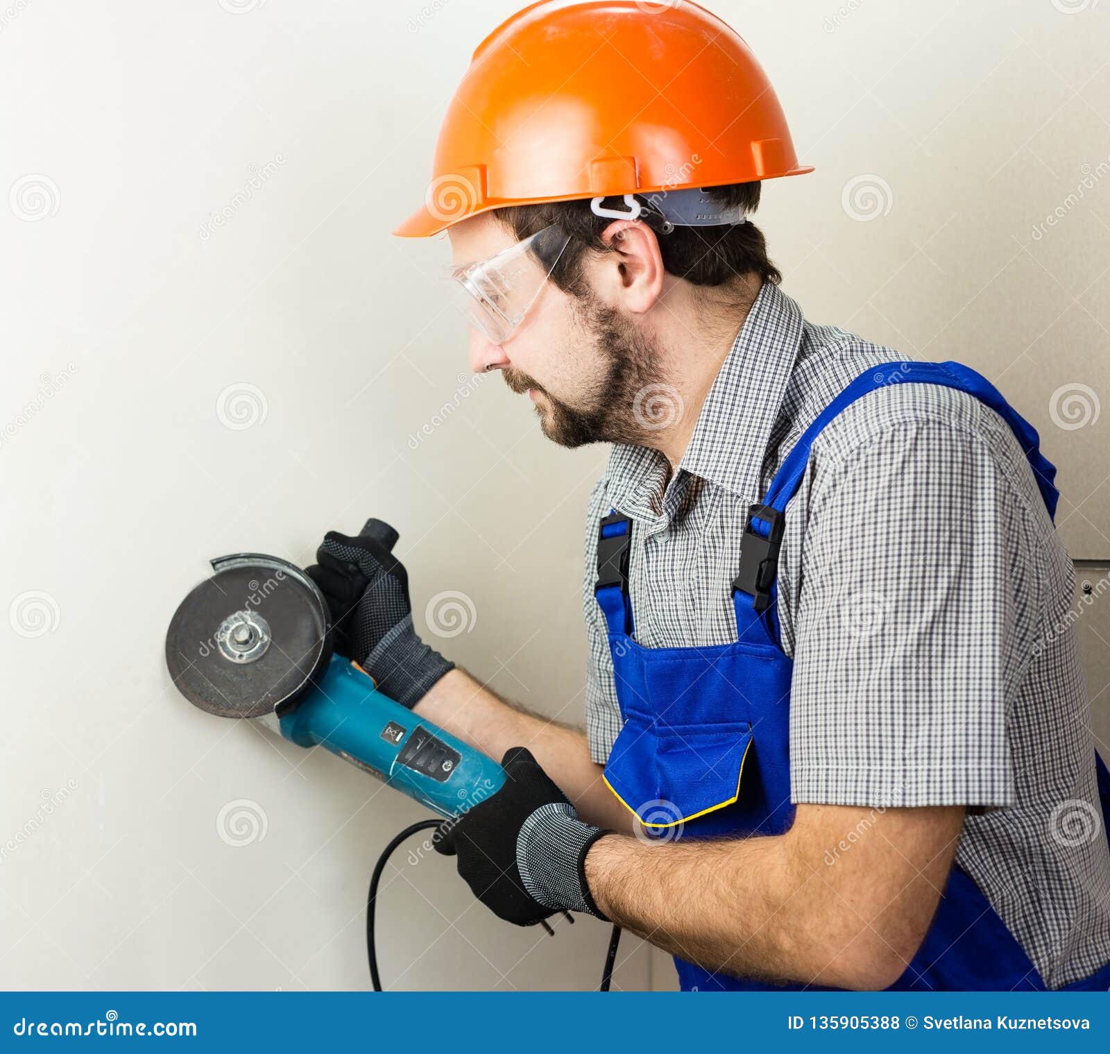 Builder with a Tool for Metal in His Hands Stock Photo - Image of large ...