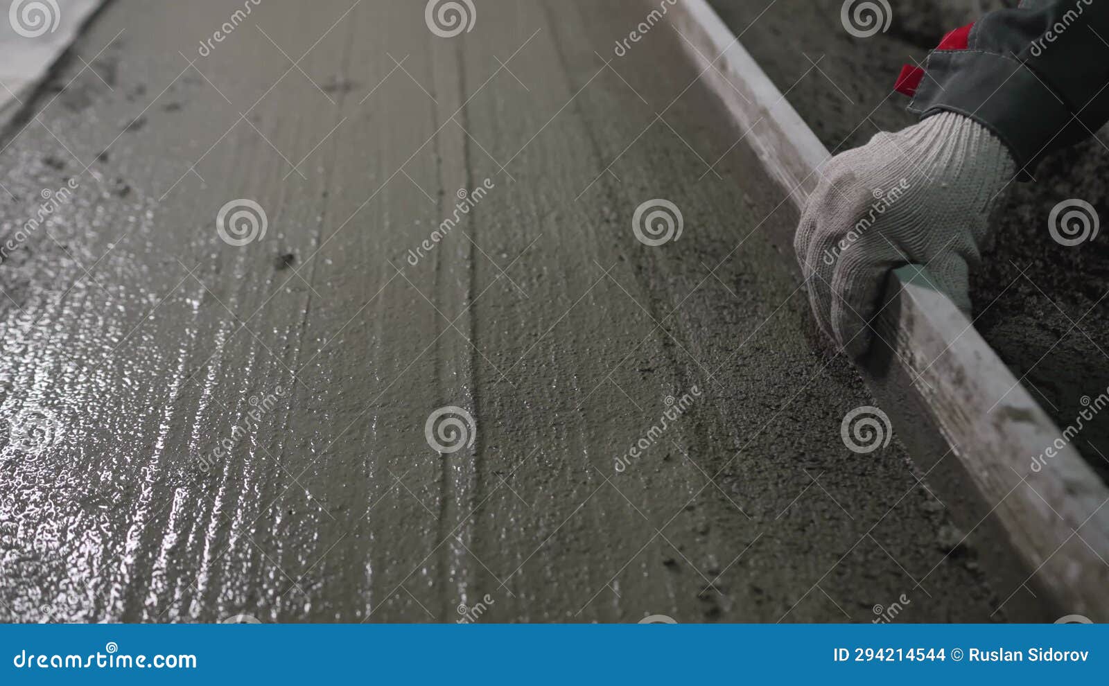 A Builder Uses a Trowel To Level a Cement Mortar Screed. Concrete Work ...