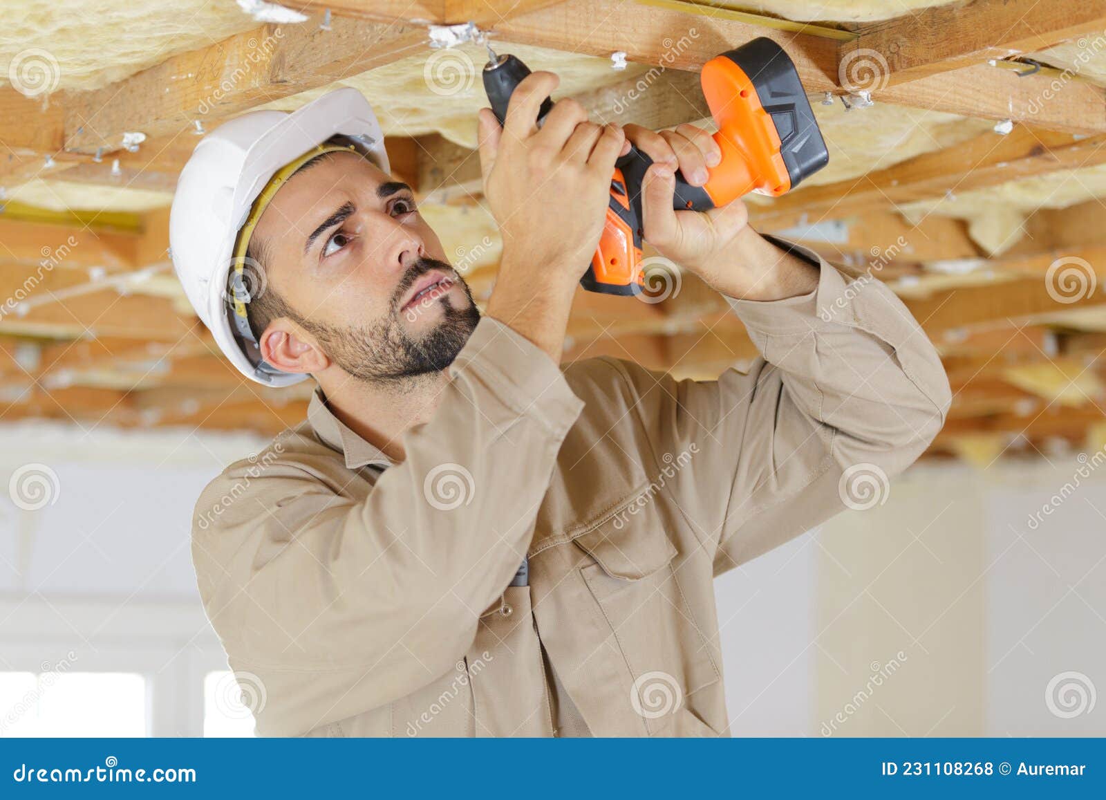 Builder Using Cordless Drill on Wooden Ceiling Stock Photo - Image of ...