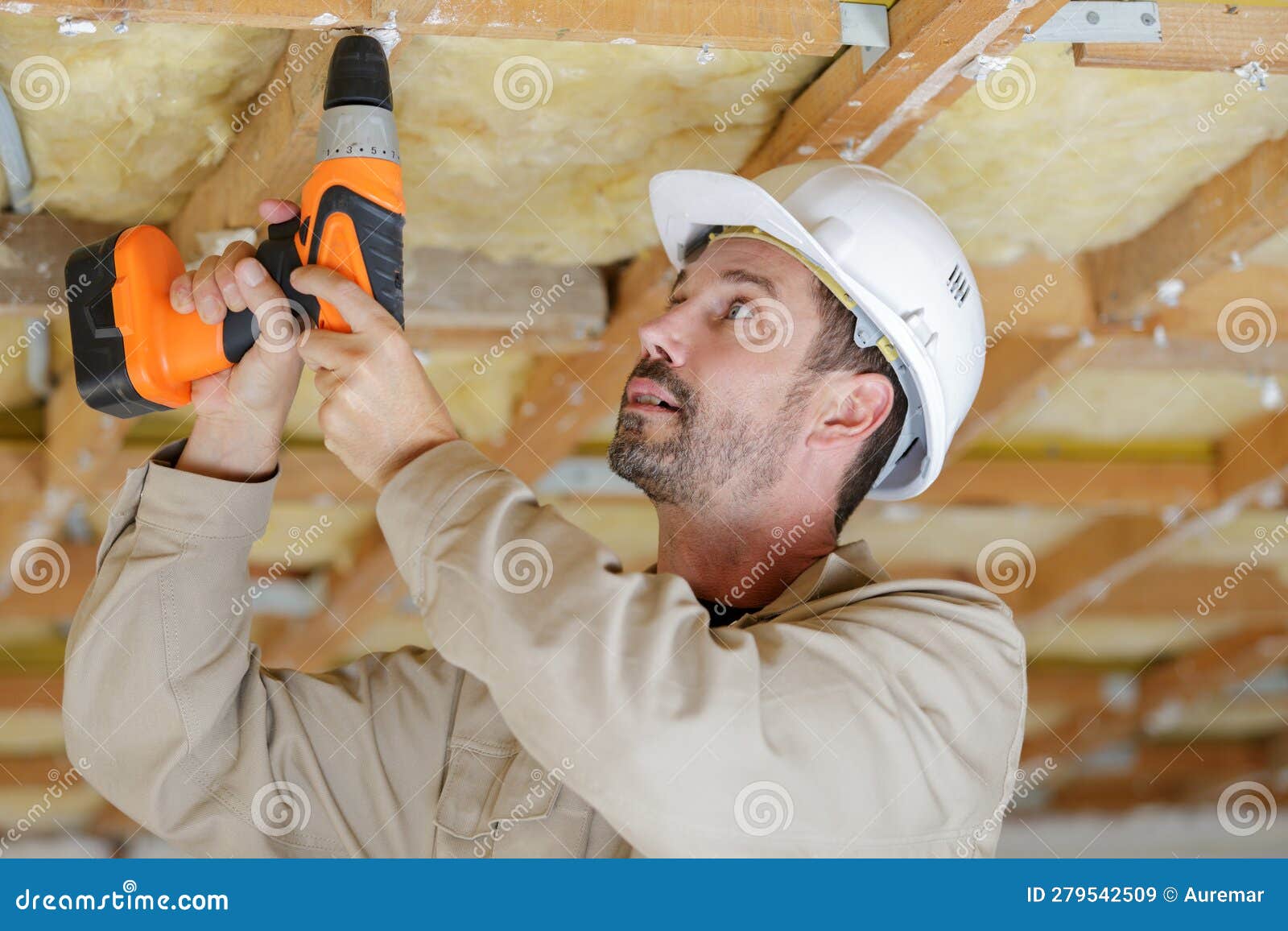 Builder Using Cordless Drill on Wooden Ceiling Joist Stock Image ...