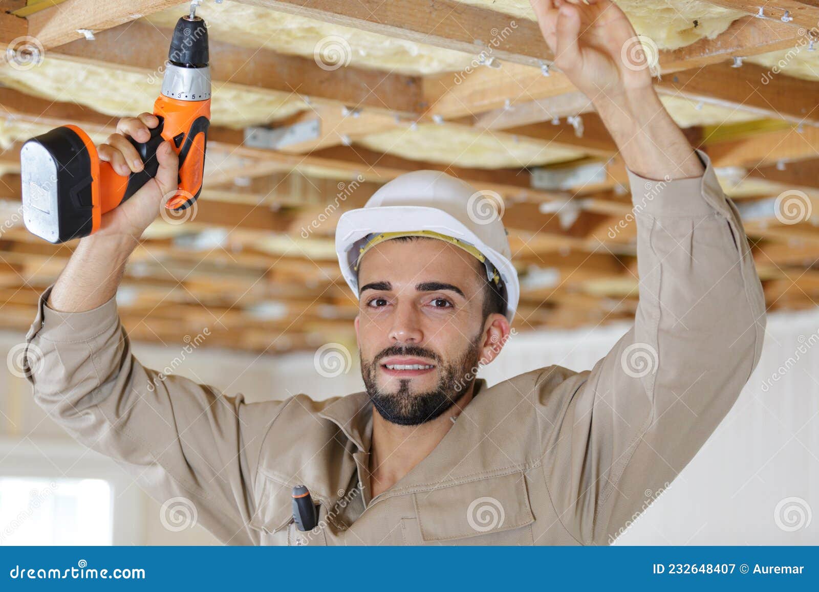 Builder Using Cordless Drill on Wooden Ceiling Overhead Stock Image ...