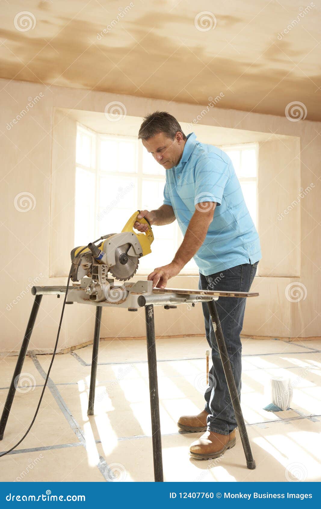 Builder Using Electric Saw stock photo. Image of manual - 12407760