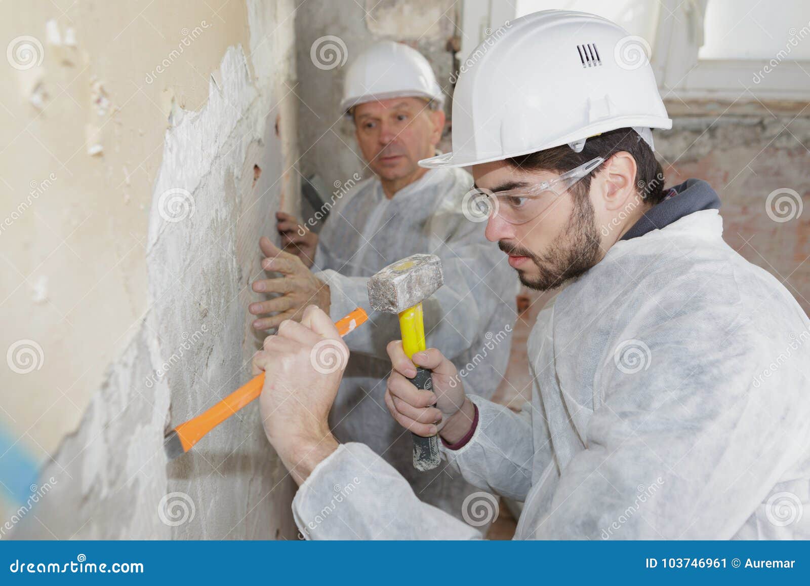 Builder Using Hammer To Remove Plaster from Wall Stock Image - Image of ...