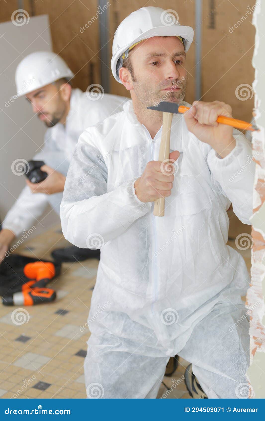 Builder Using Hammer To Remove Plaster from Wall Stock Image - Image of ...
