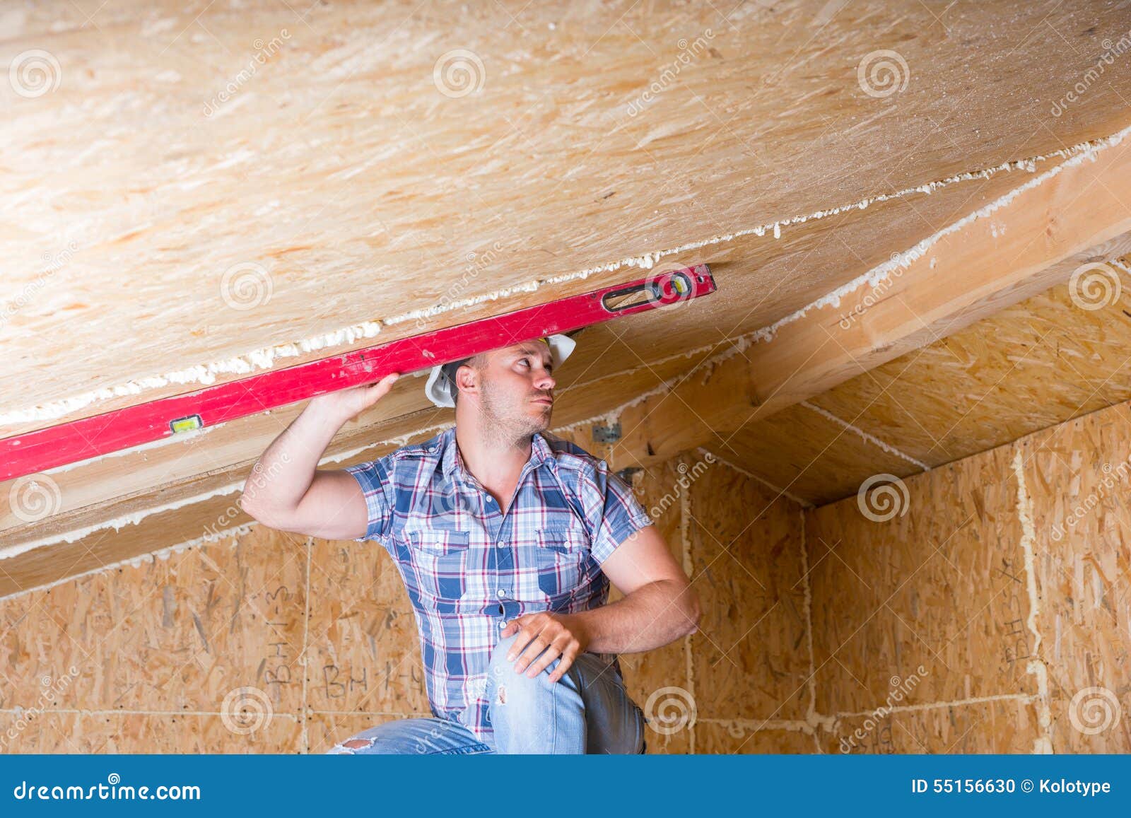 Builder Using Level on Ceiling in Unfinished Home Stock Photo - Image ...