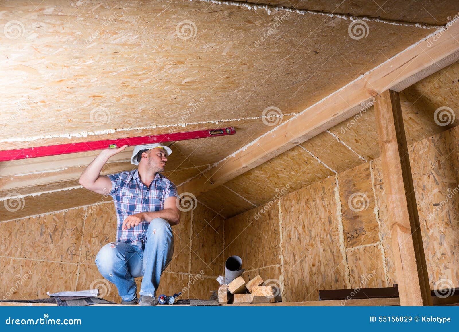 Builder Using Level on Ceiling in Unfinished Home Stock Image - Image ...