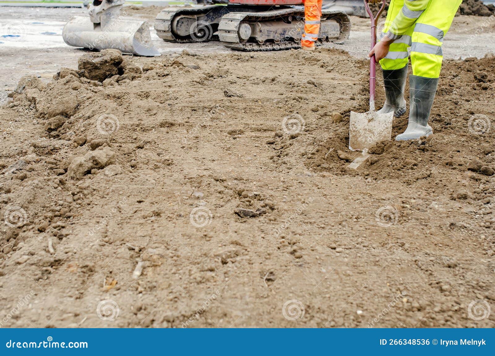 Builder Using Shovel To Clean Kerbs and Footpath Acidentaly Covered by ...