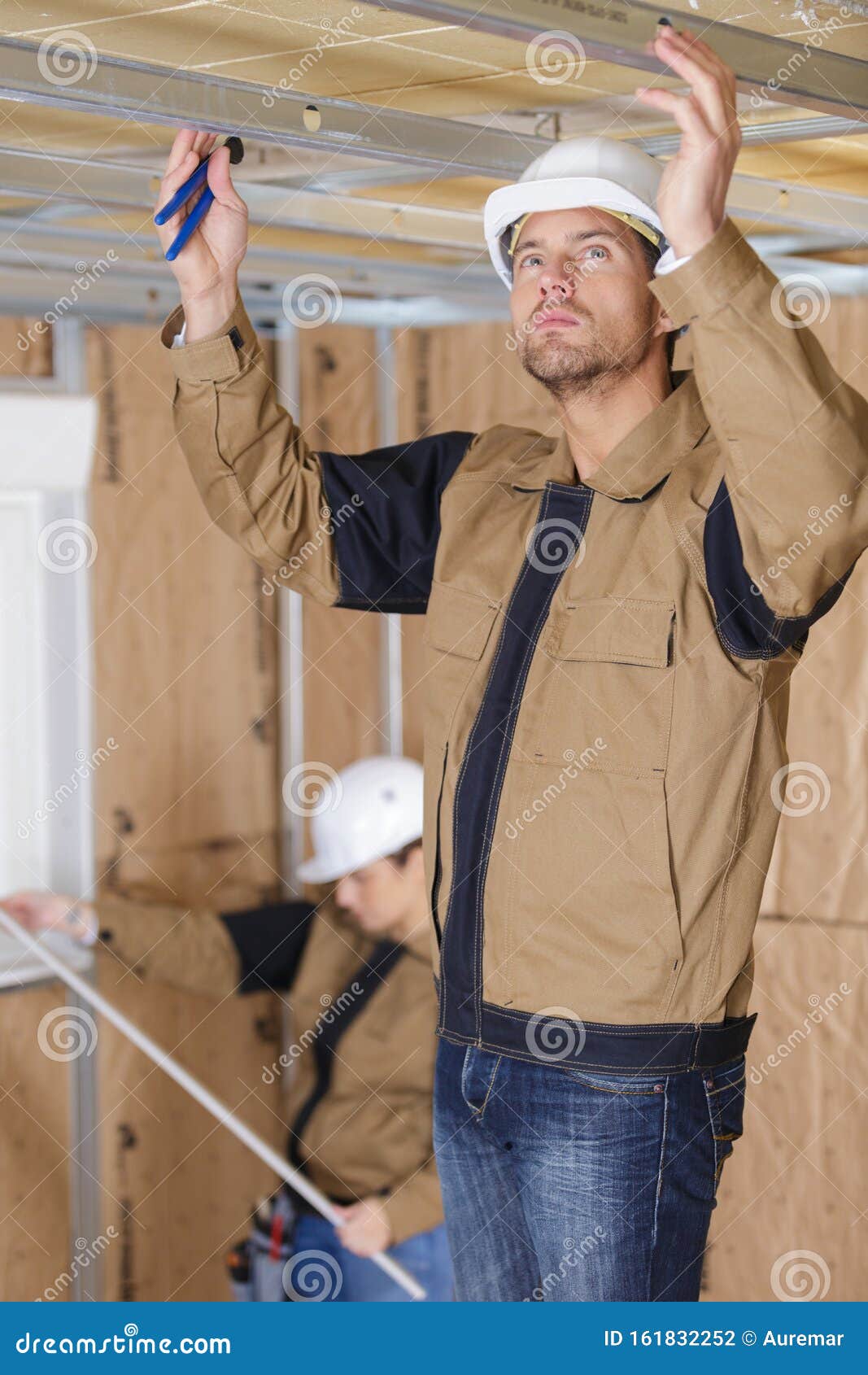 Builder Using Tool To Fix Ceiling Stock Photo - Image of tool ...