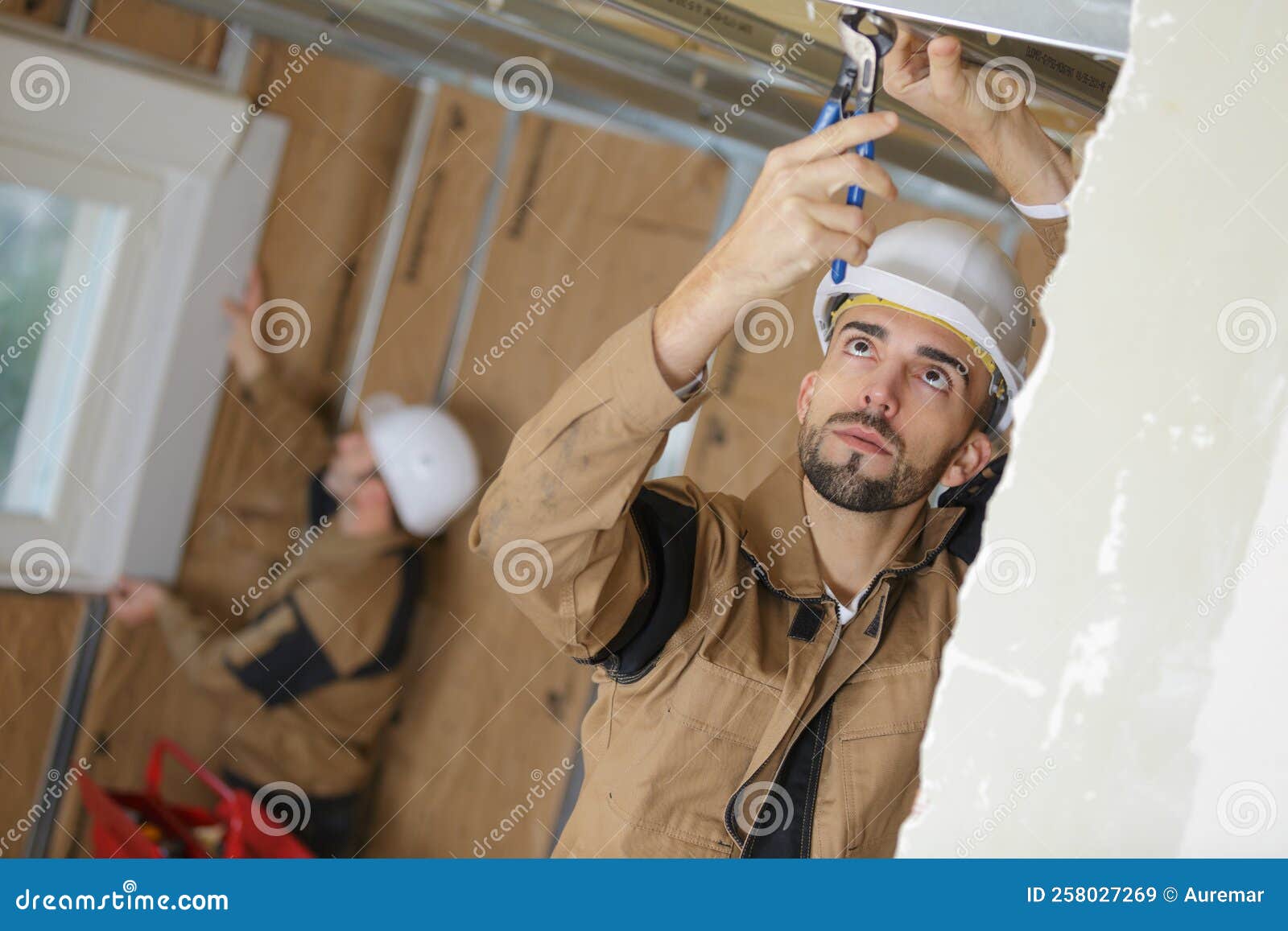 Builder Using Tool To Fix Ceiling Indoors Stock Image - Image of ...