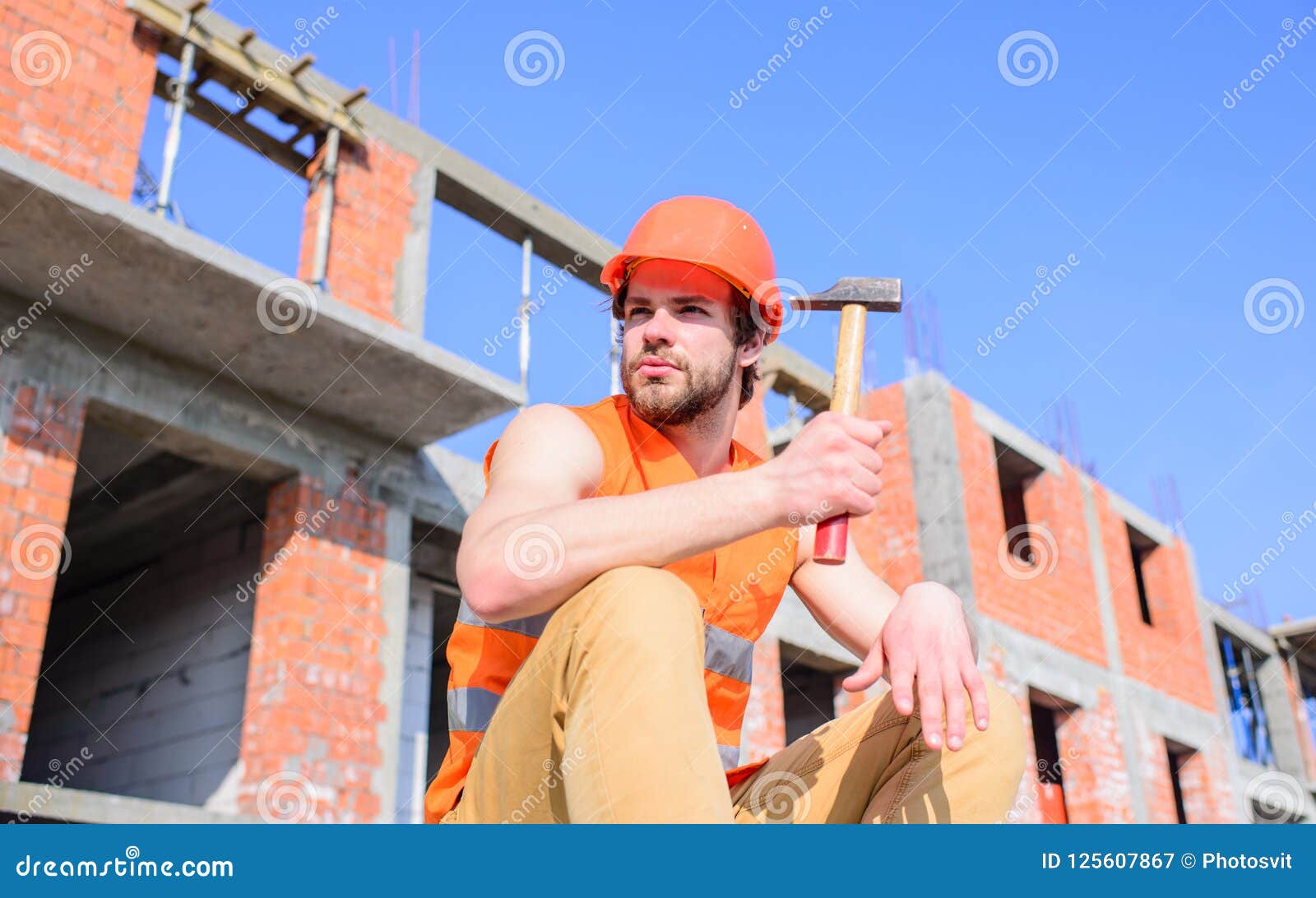 Builder Vest and Helmet Construction Site Sit Relaxing. Guy Protective ...
