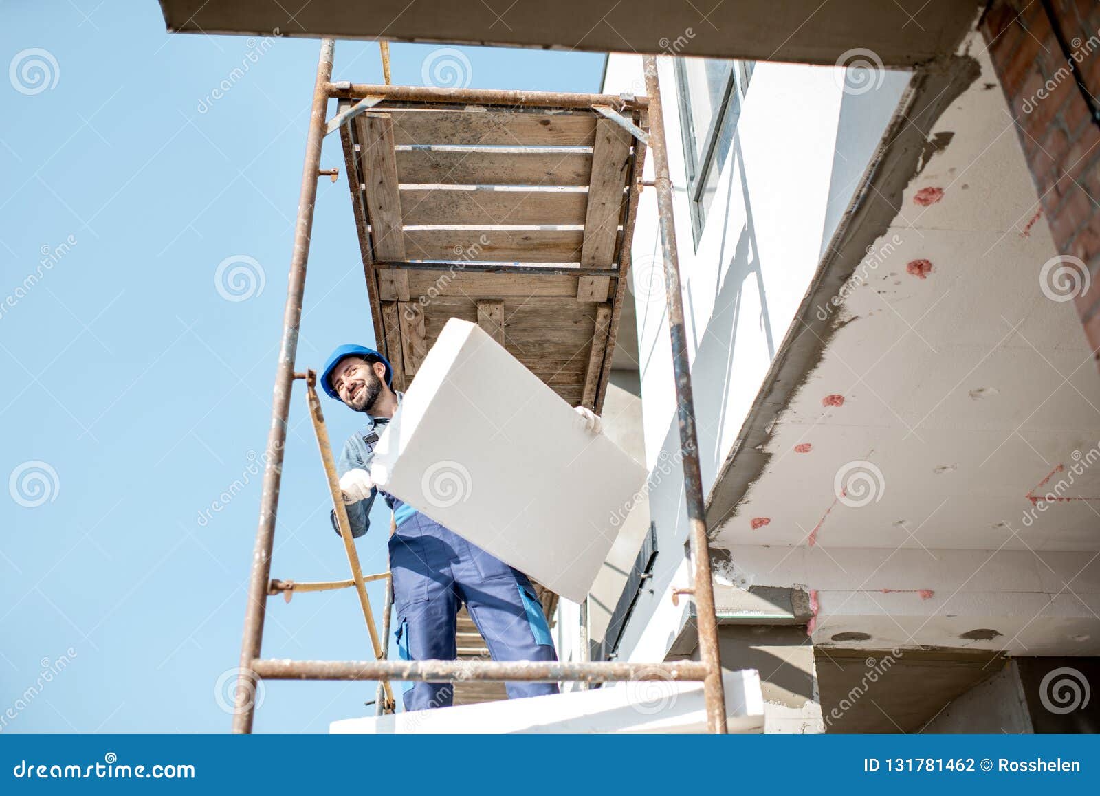 Workman Warming Building Facade Stock Photo - Image of wall, repair ...