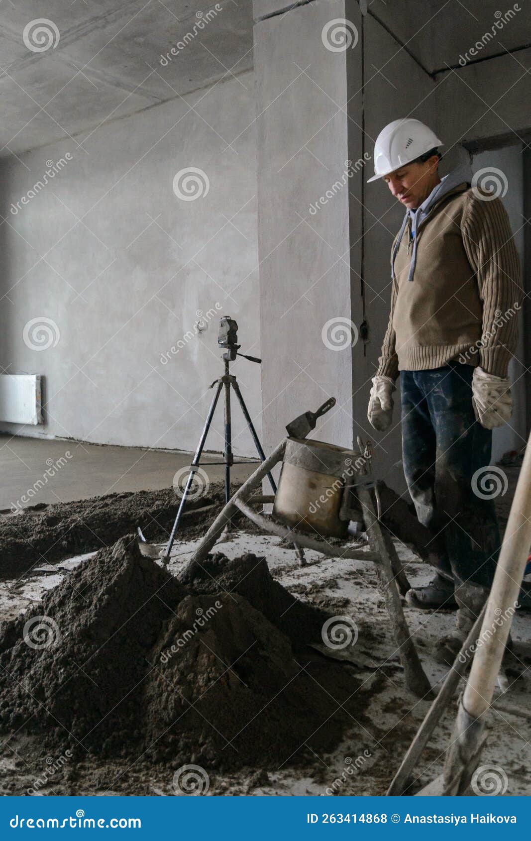 A Builder in Work Clothes is Doing His Job Stock Photo - Image of ...