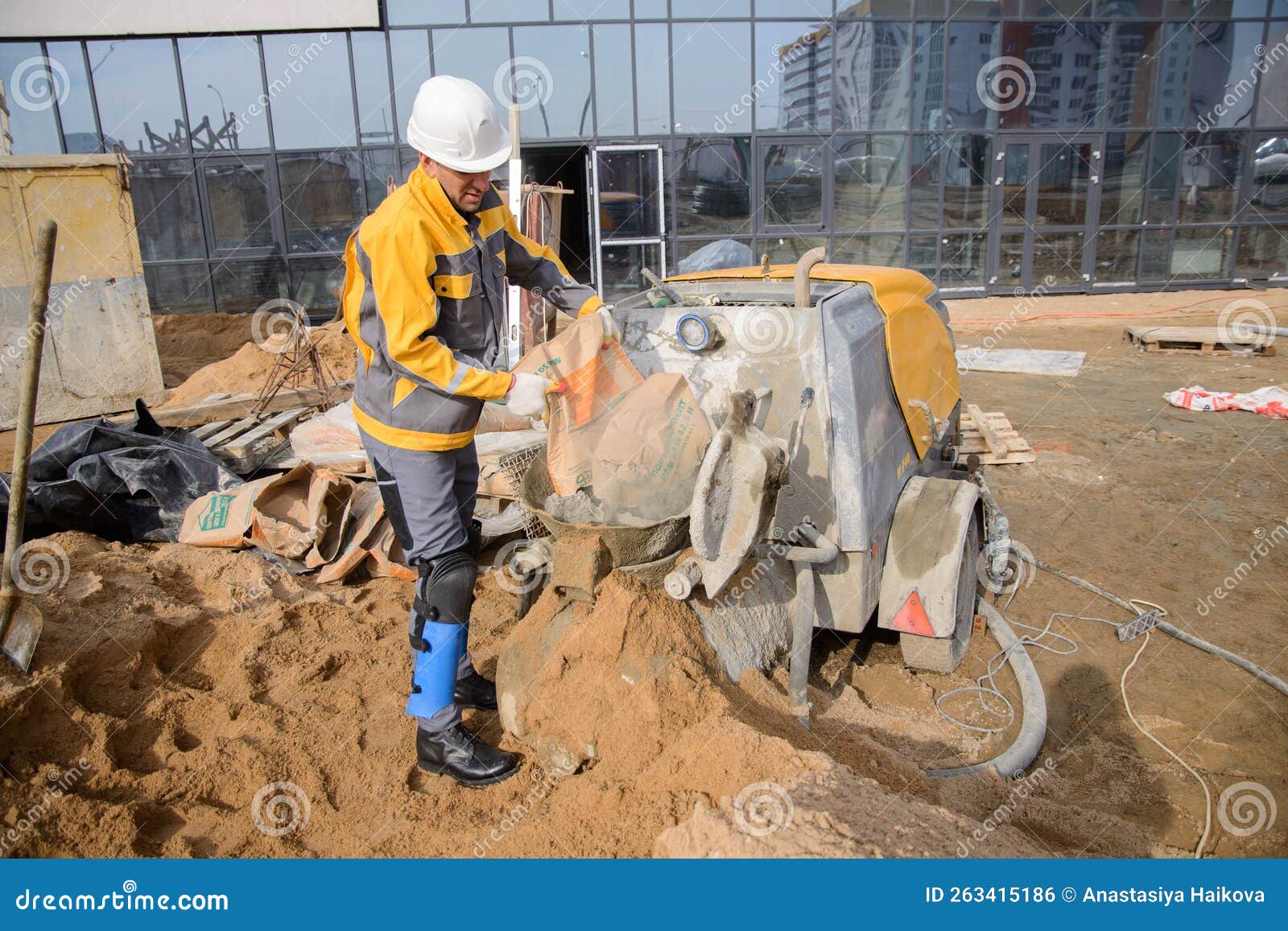 A Builder in Work Clothes is Doing His Job Stock Photo - Image of ...