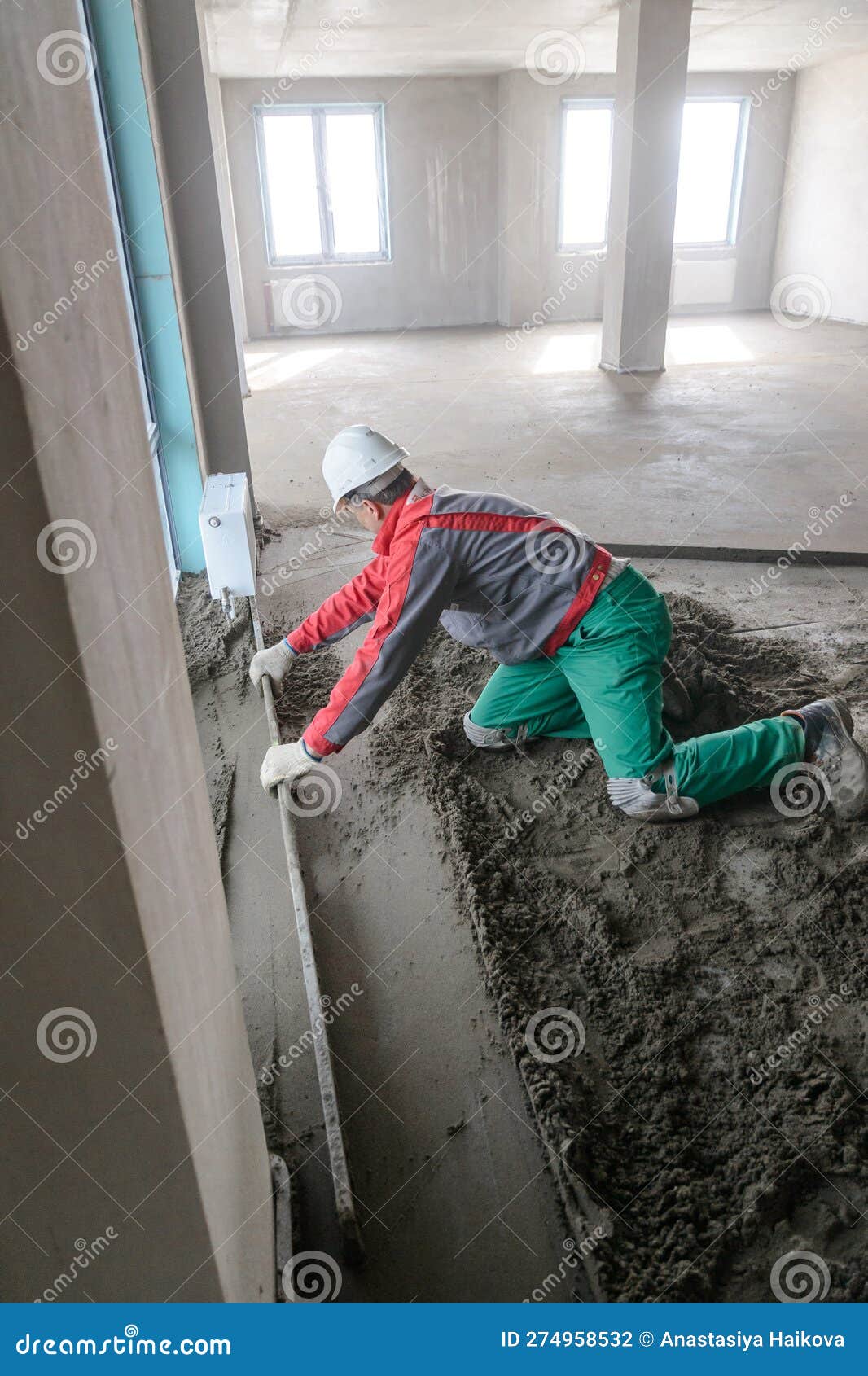 A Builder in Work Clothes is Doing His Job Stock Photo - Image of ...