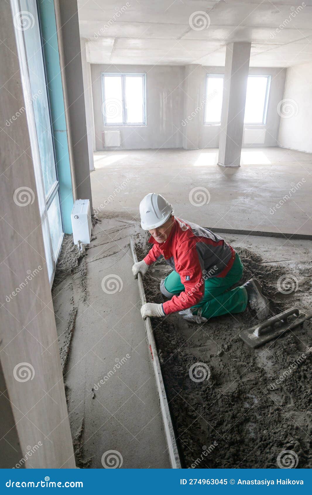 A Builder in Work Clothes is Doing His Job Stock Image - Image of ...