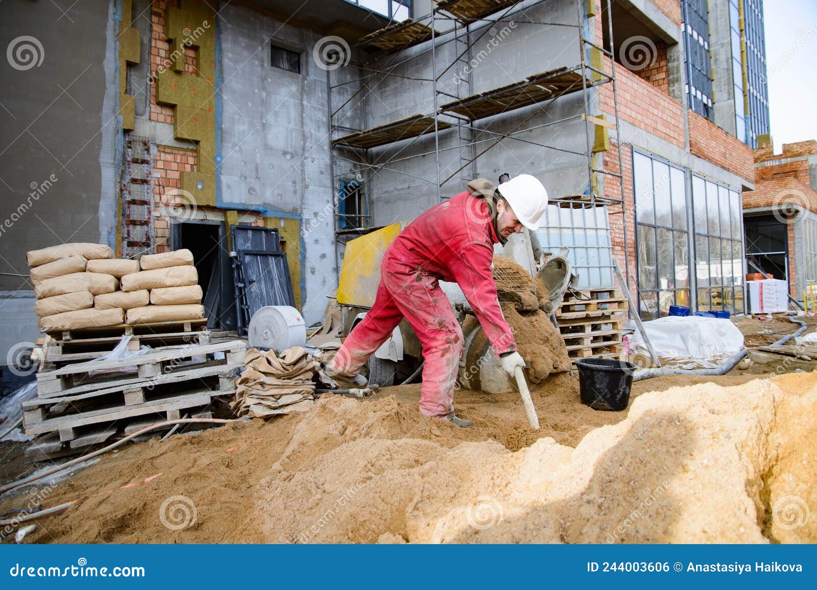 A Builder in Work Clothes is Doing His Job Stock Photo - Image of labor ...