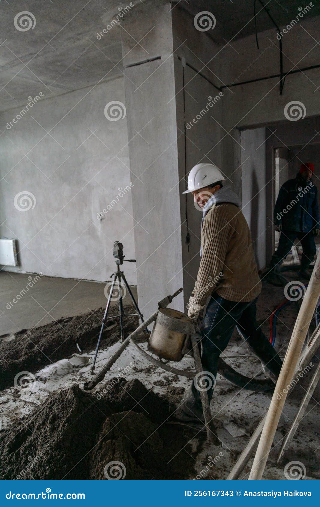 A Builder in Work Clothes is Doing His Job Stock Image - Image of ...