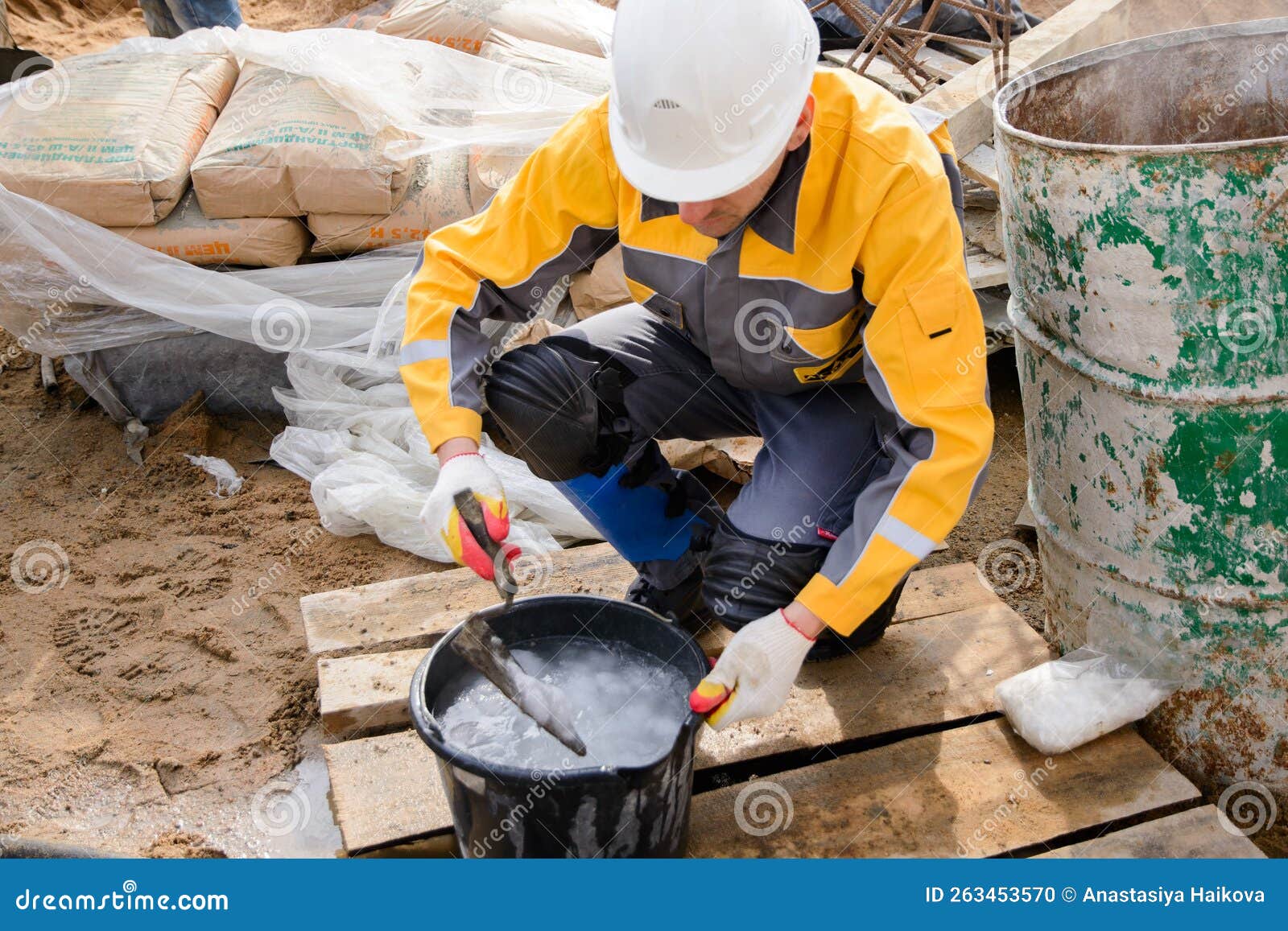 Builder in Work Clothes Prepares Tools and Materials Stock Photo ...