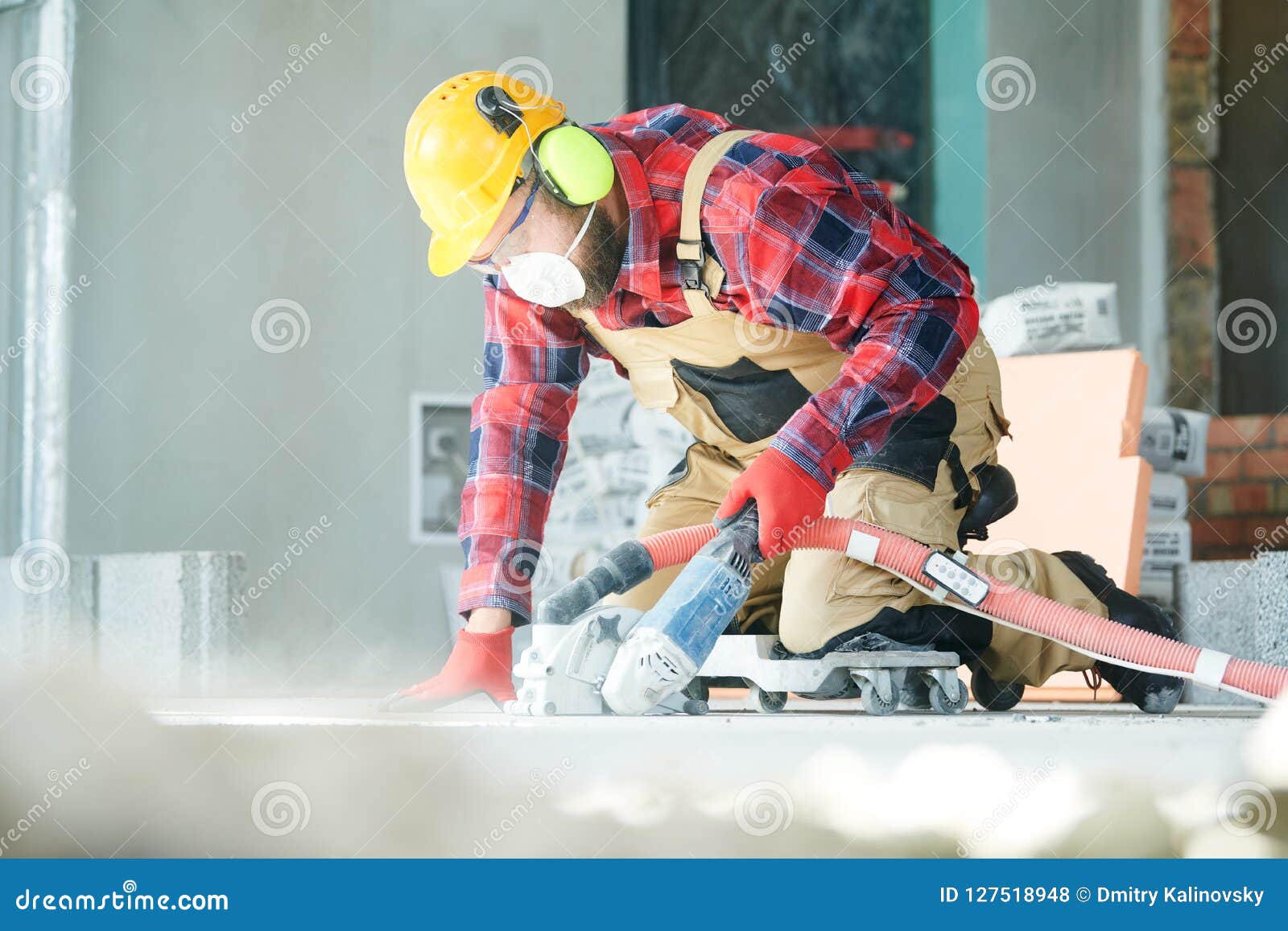 Builder at Work. Cutting Concrete Floor for Cabling by Diamond Slitting ...