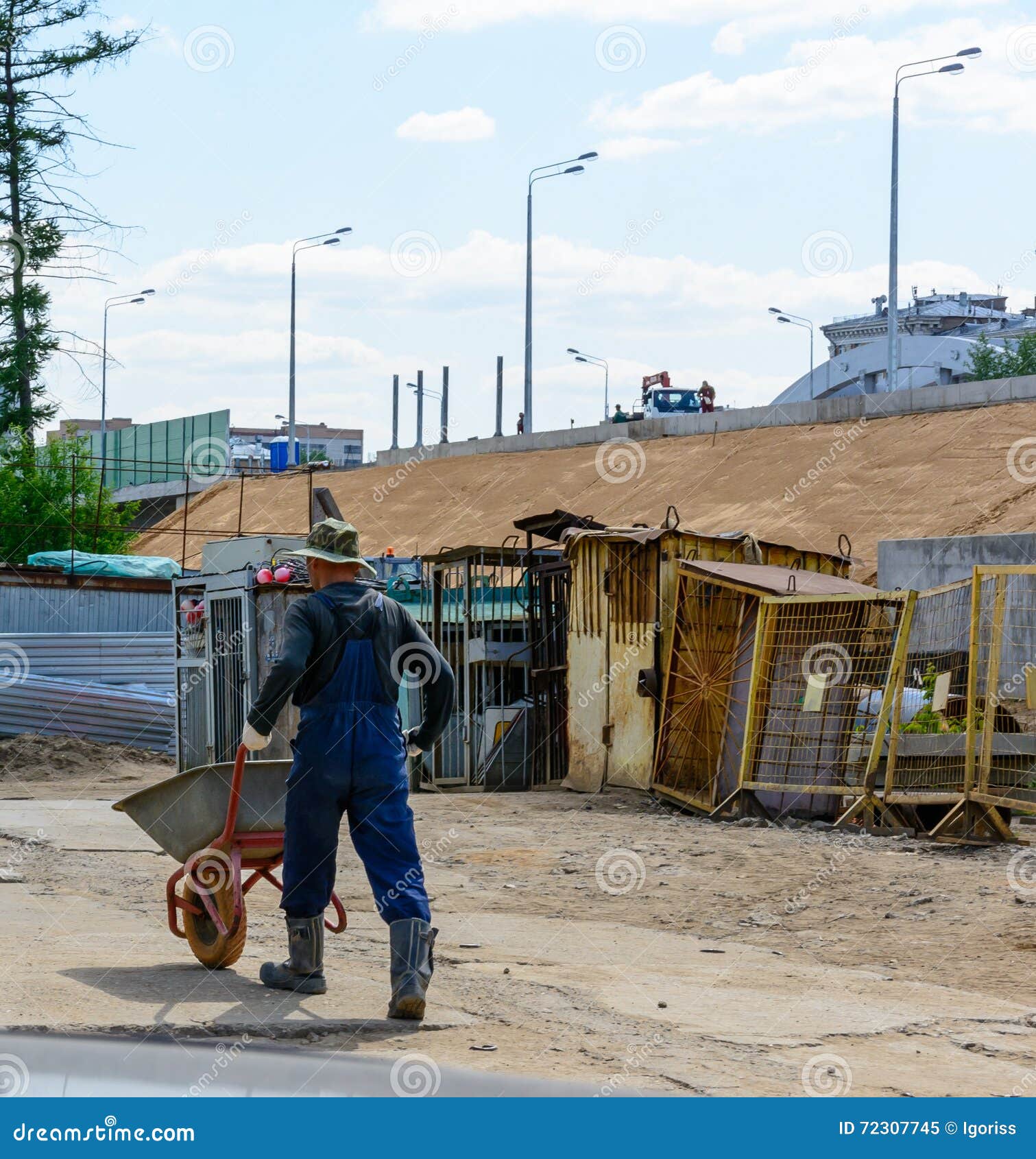 Builder Worker Carries a Wheelbarrow Editorial Image - Image of ...