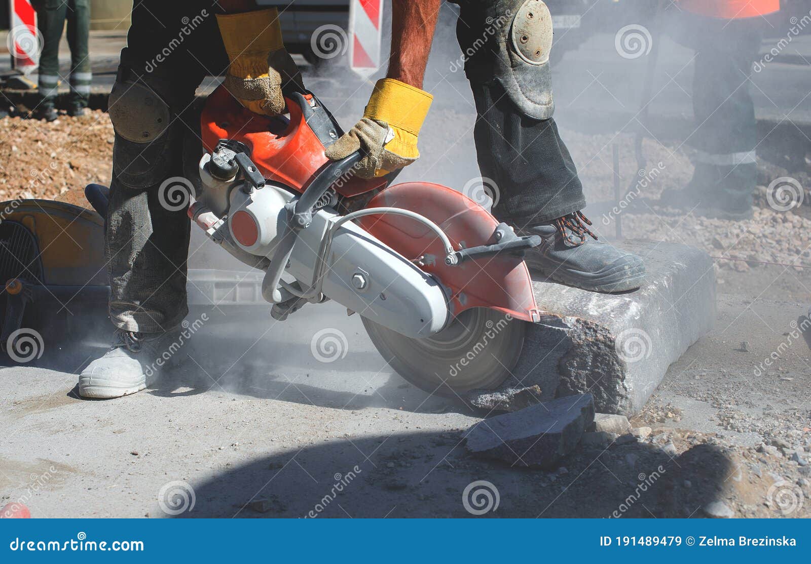 Builder Worker with Cut-off Machine Power Tool Breaking Concrete at ...