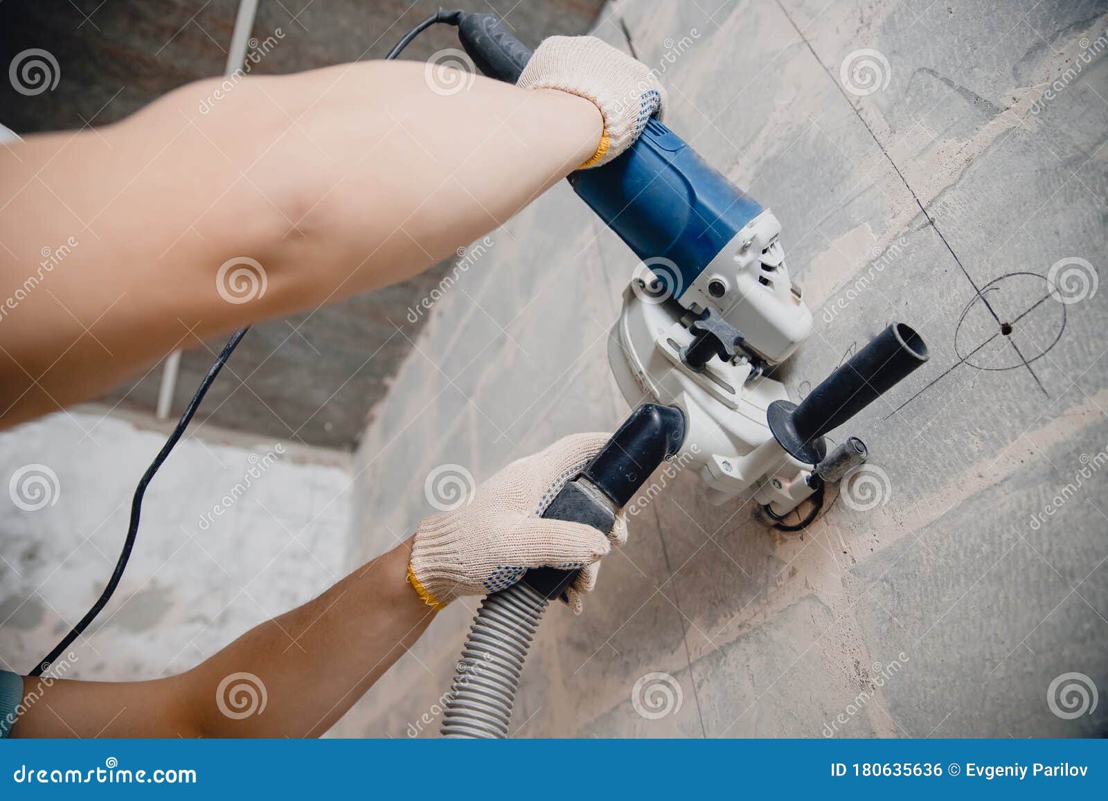 Builder Worker Cutting Electrical Chase in Concrete Wall with ...
