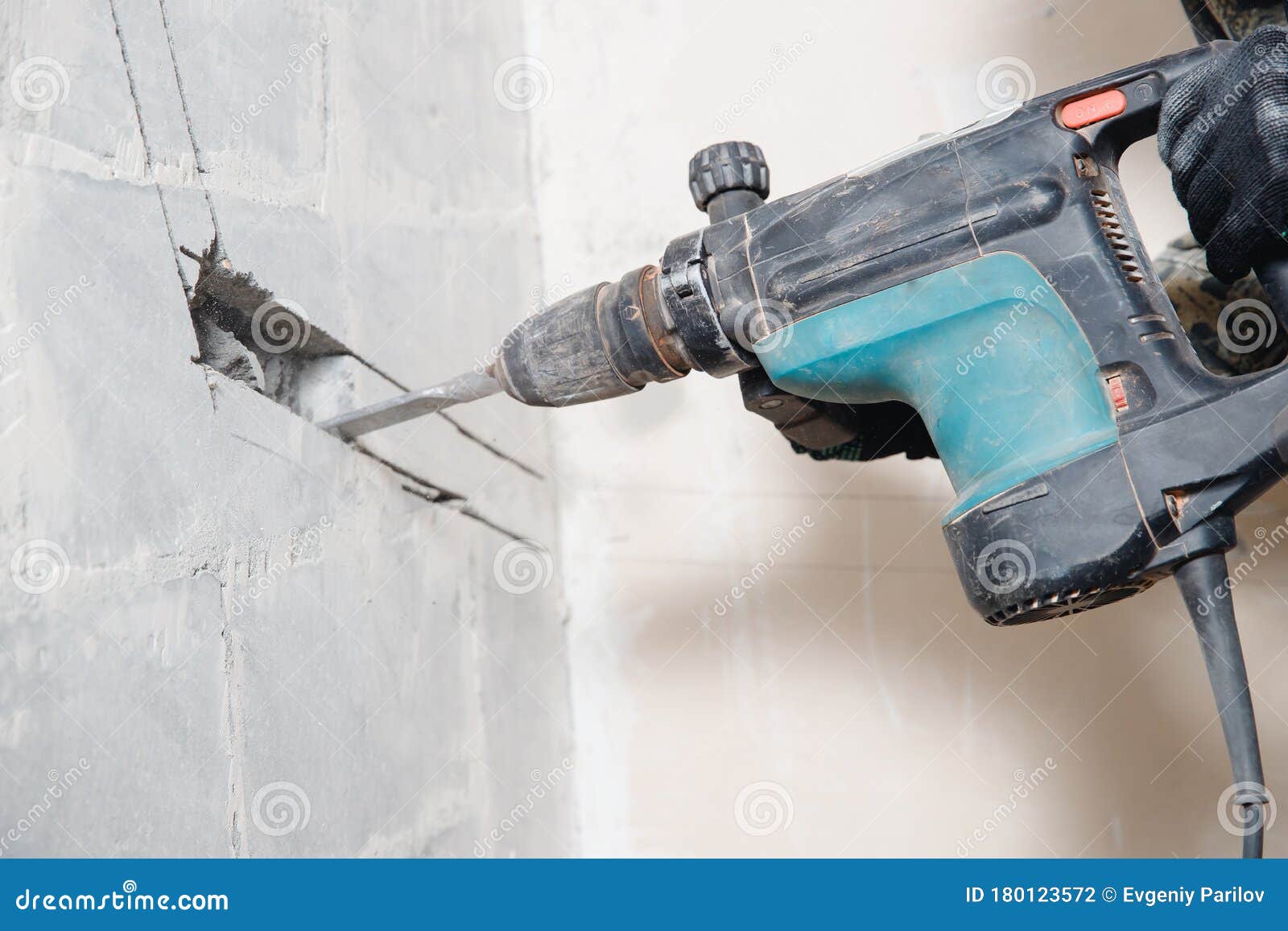 Builder Worker Man Using Jackhammer To Drill into Construction Wall for ...