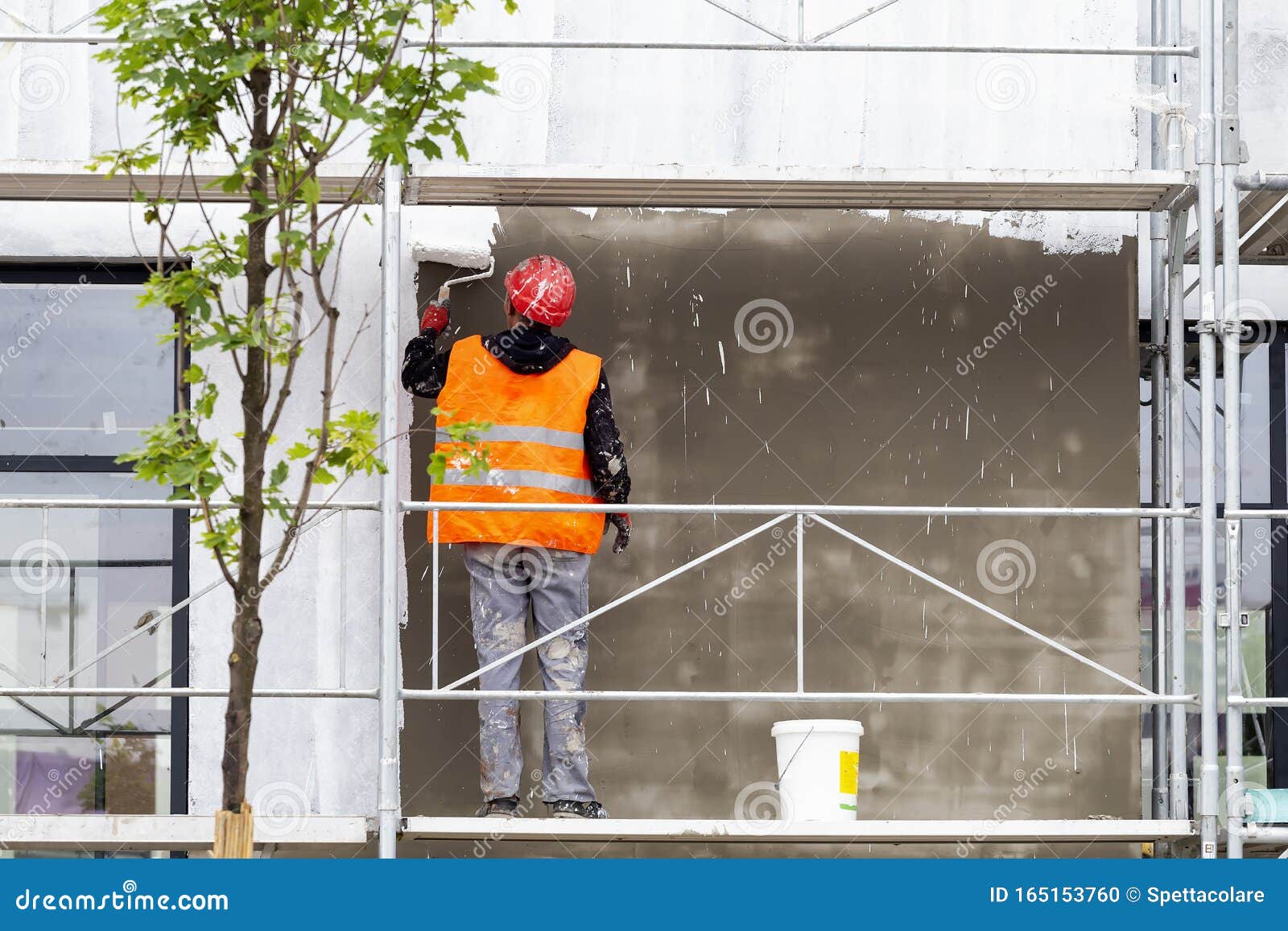 Builder Worker Painting Wall with Roller Stock Photo - Image of helmet ...