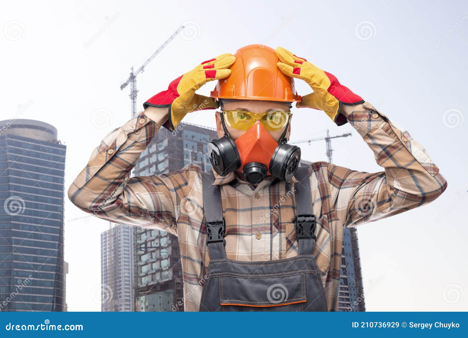 Builder Worker in Personal Protective Equipment at Construction Site ...