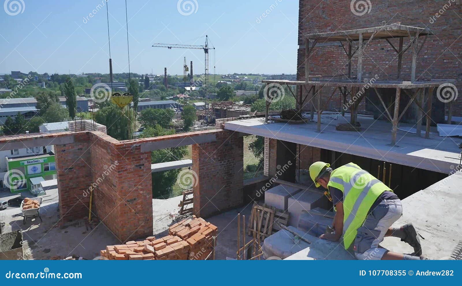 Builder Worker in Safety Protective Equipment Installing Concrete Floor ...