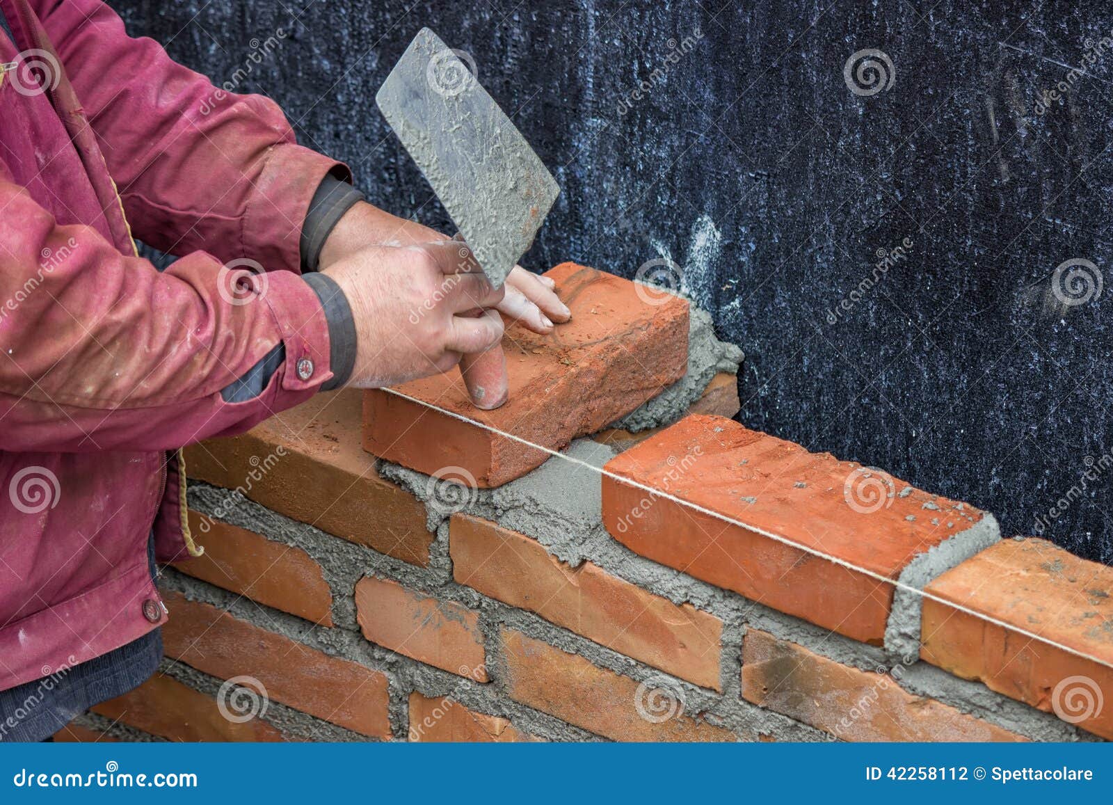 Builder Worker with Trowel Laying Solid Clay Brick Stock Photo - Image ...