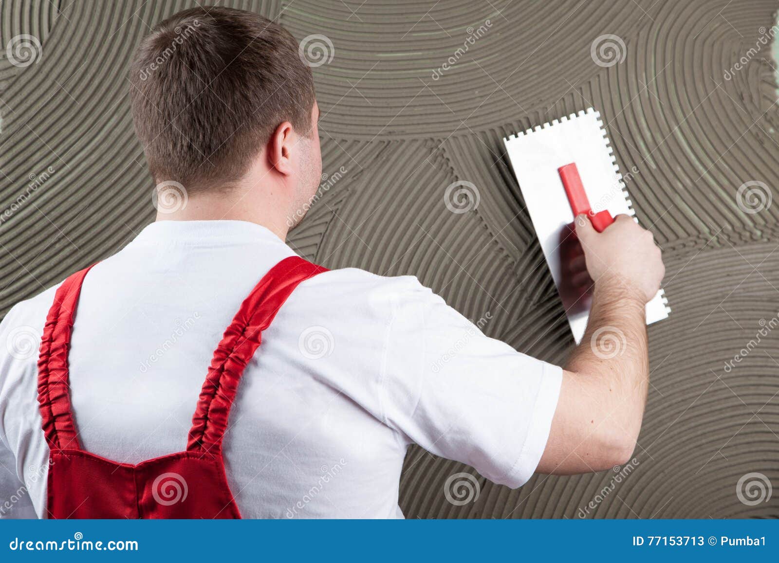 Builder Worker at Wall of House Construction. Focus on Man Stock Image ...