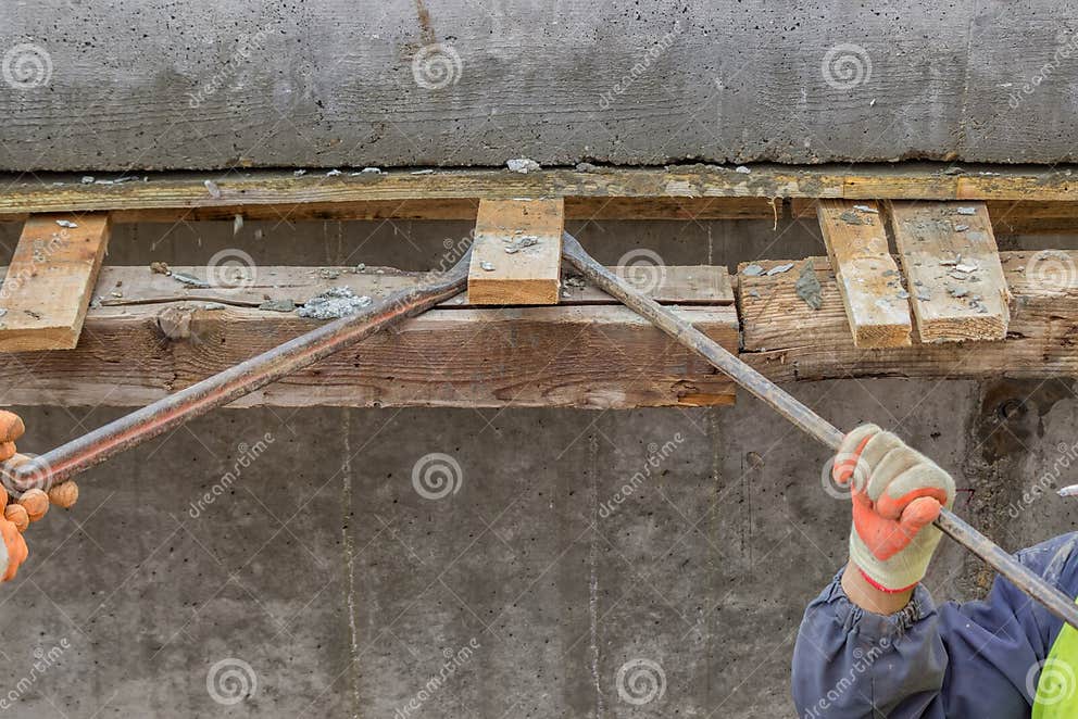 Builder Workers Removing Formwork Elements with Crowbar Stock Image ...