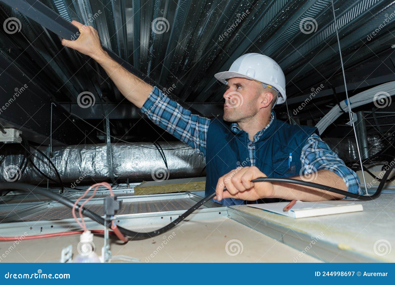 Builder working on ceiling stock image. Image of carpenter - 244998697