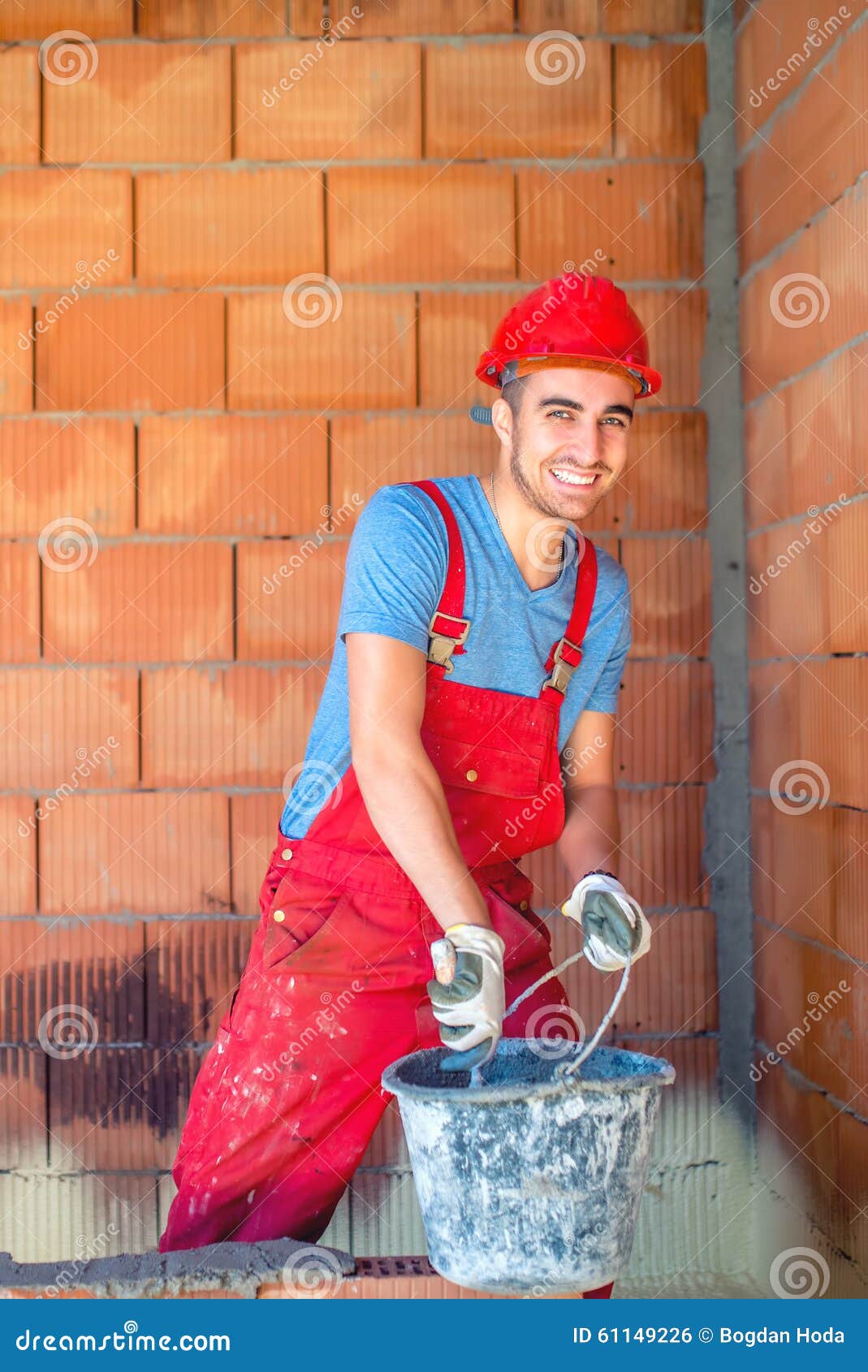 Builder Working with Mortar, Bricks and Tools on Construction Site ...