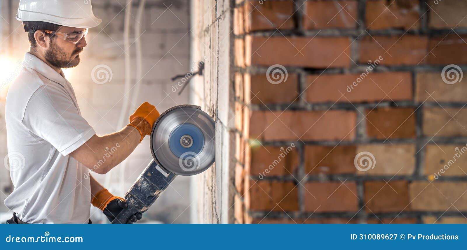 Builder Works with a Angle Grinder To Cut Bricks and Build Interior ...