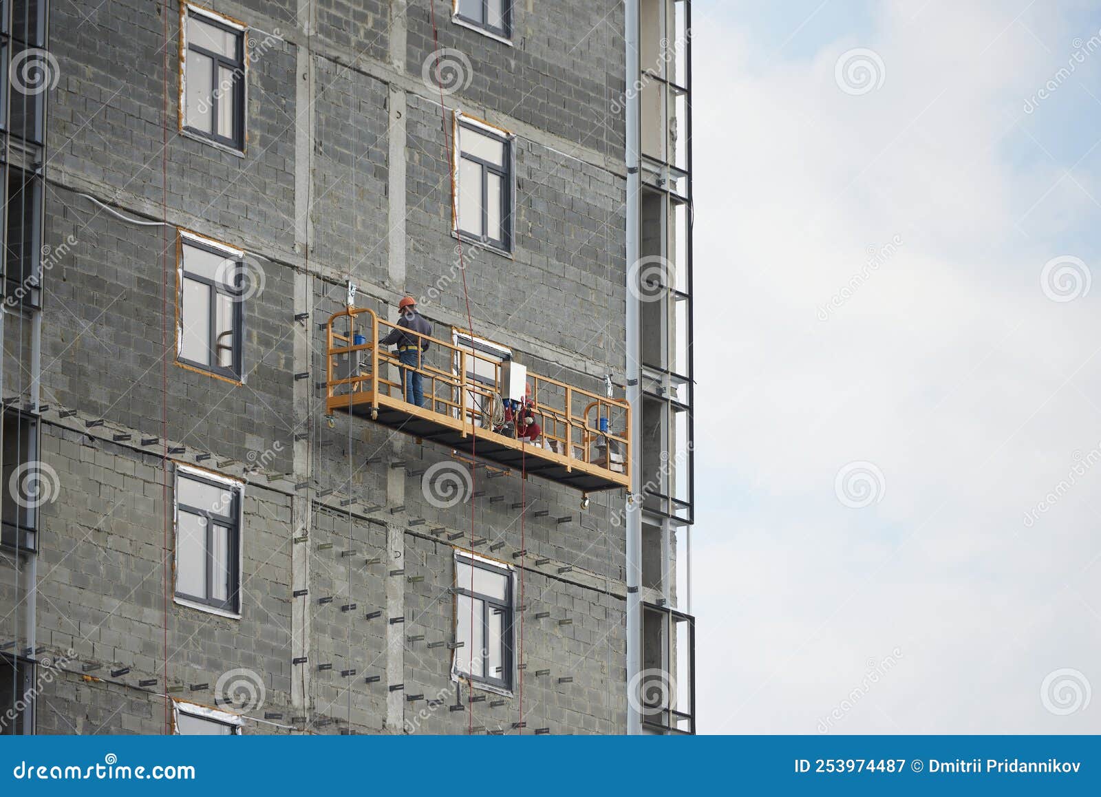 Builder Works in a Special Suspended Platform at the Construction of an ...