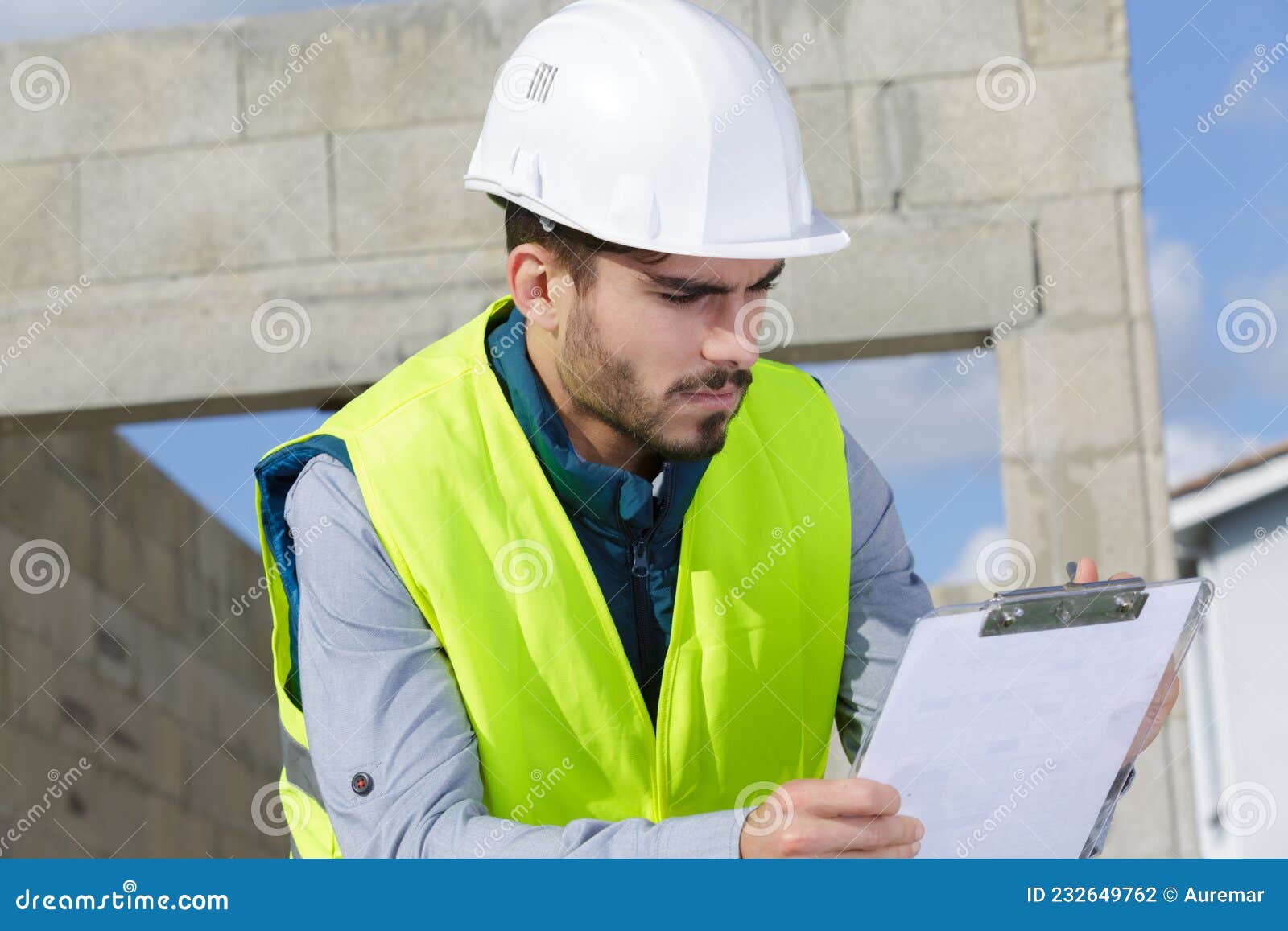 Builder Writing Report at Construction Site Stock Photo - Image of ...