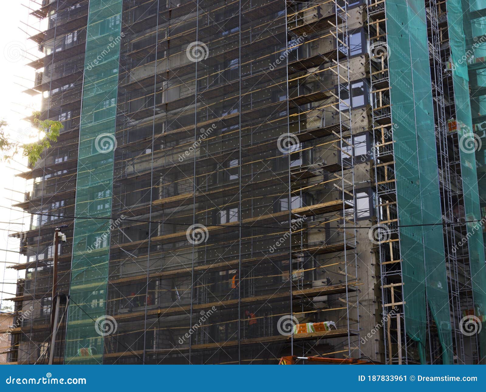 Builders are Building a Multi-storey House. Scaffolding and Materials ...