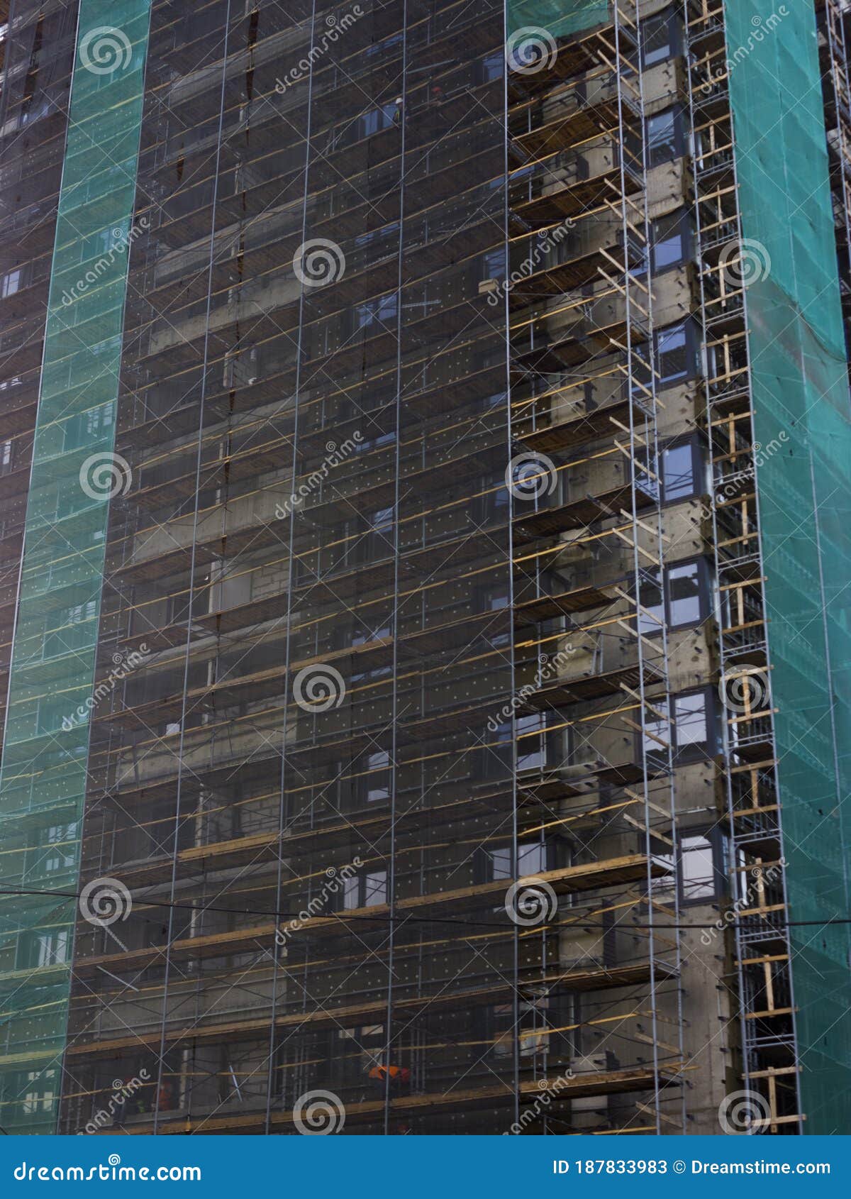 Builders are Building a Multi-storey House. Scaffolding and Materials ...