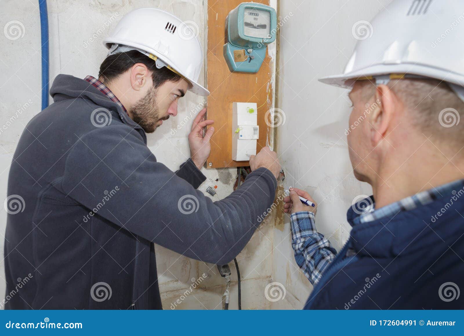 Builders Checking Electrical Panel Indoors Stock Image - Image of ...