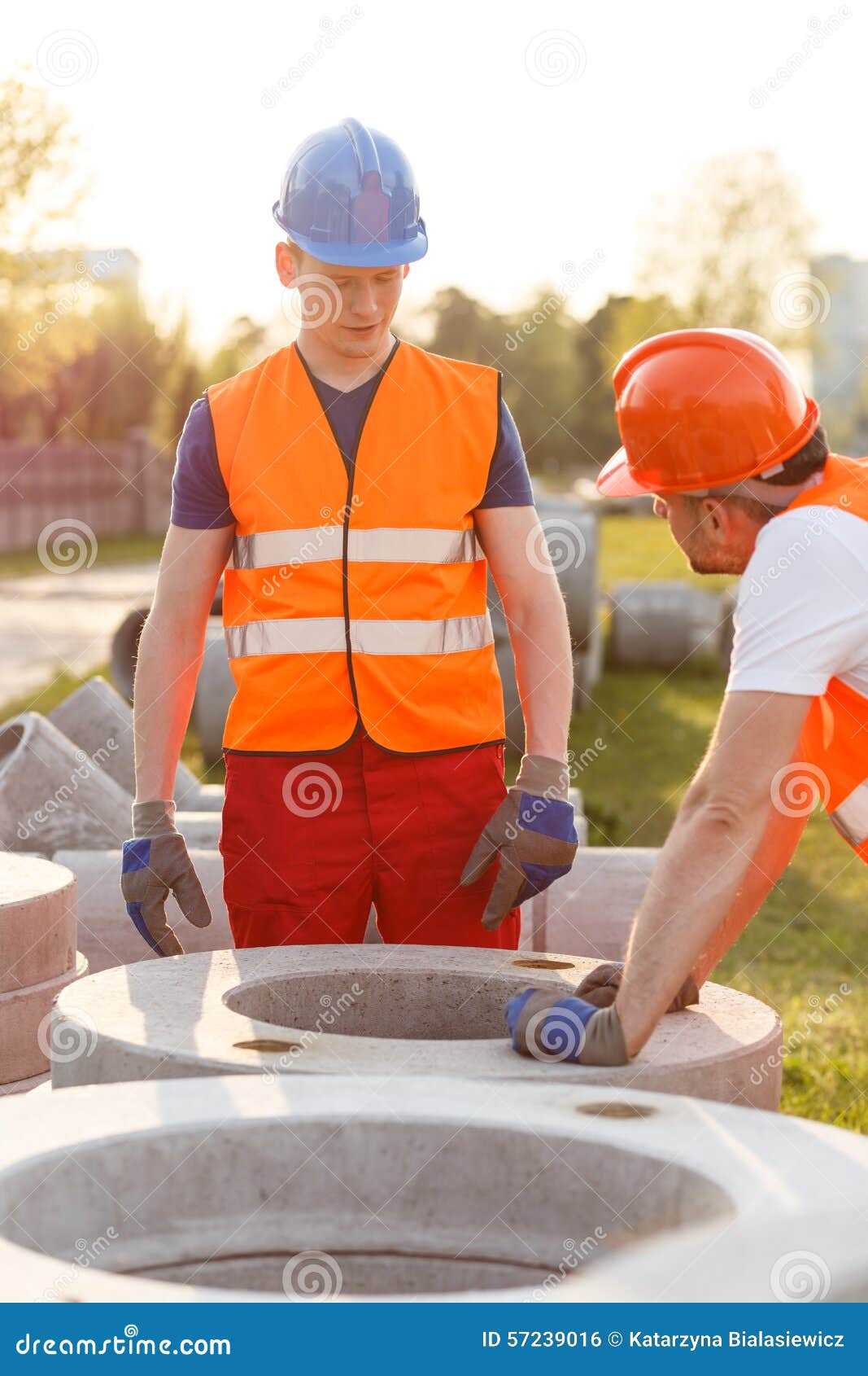 Builders and Concrete Pipes Stock Photo - Image of outdoor, build: 57239016