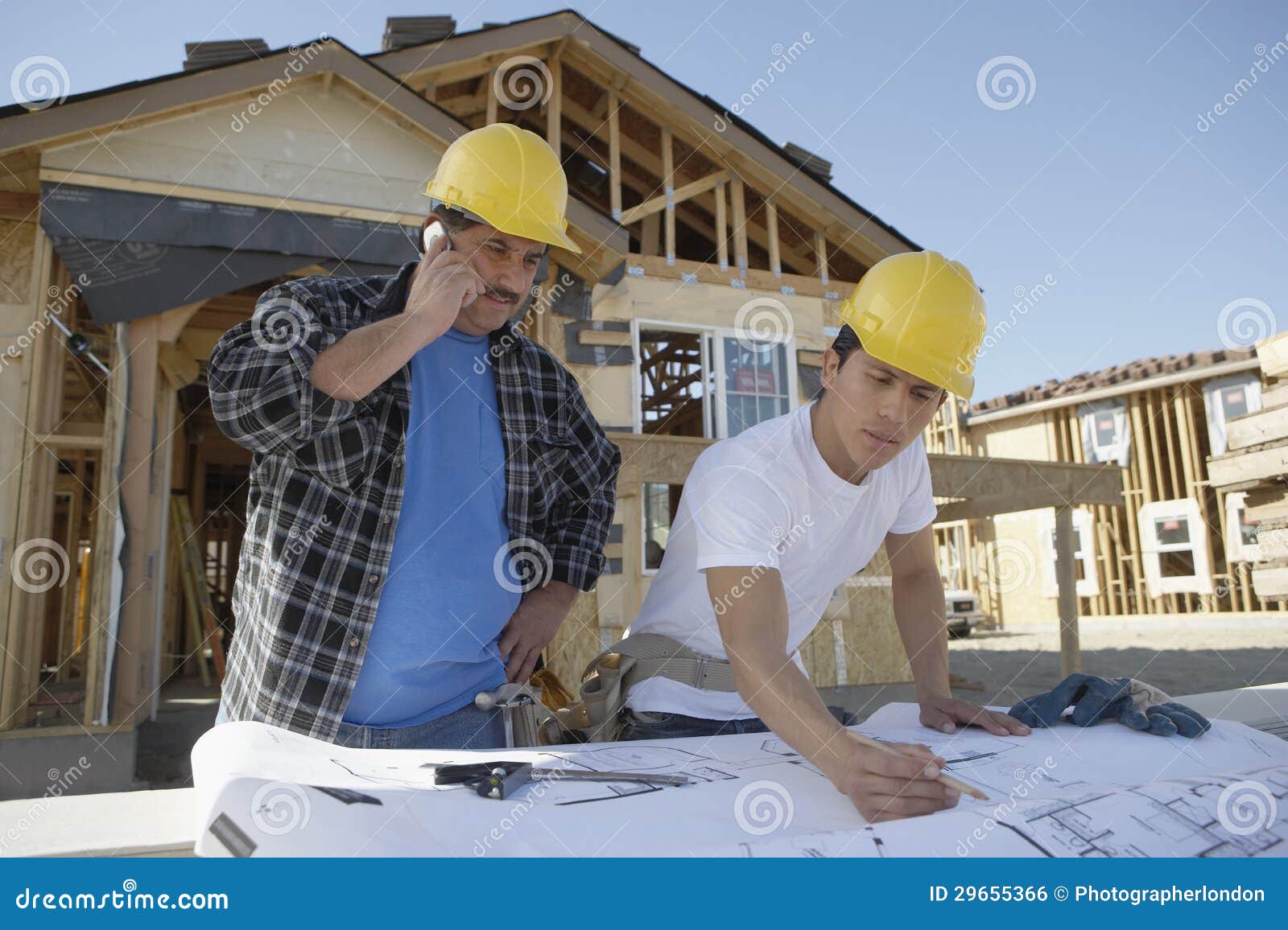 Builders at Construction Site Stock Photo - Image of blueprint, people ...