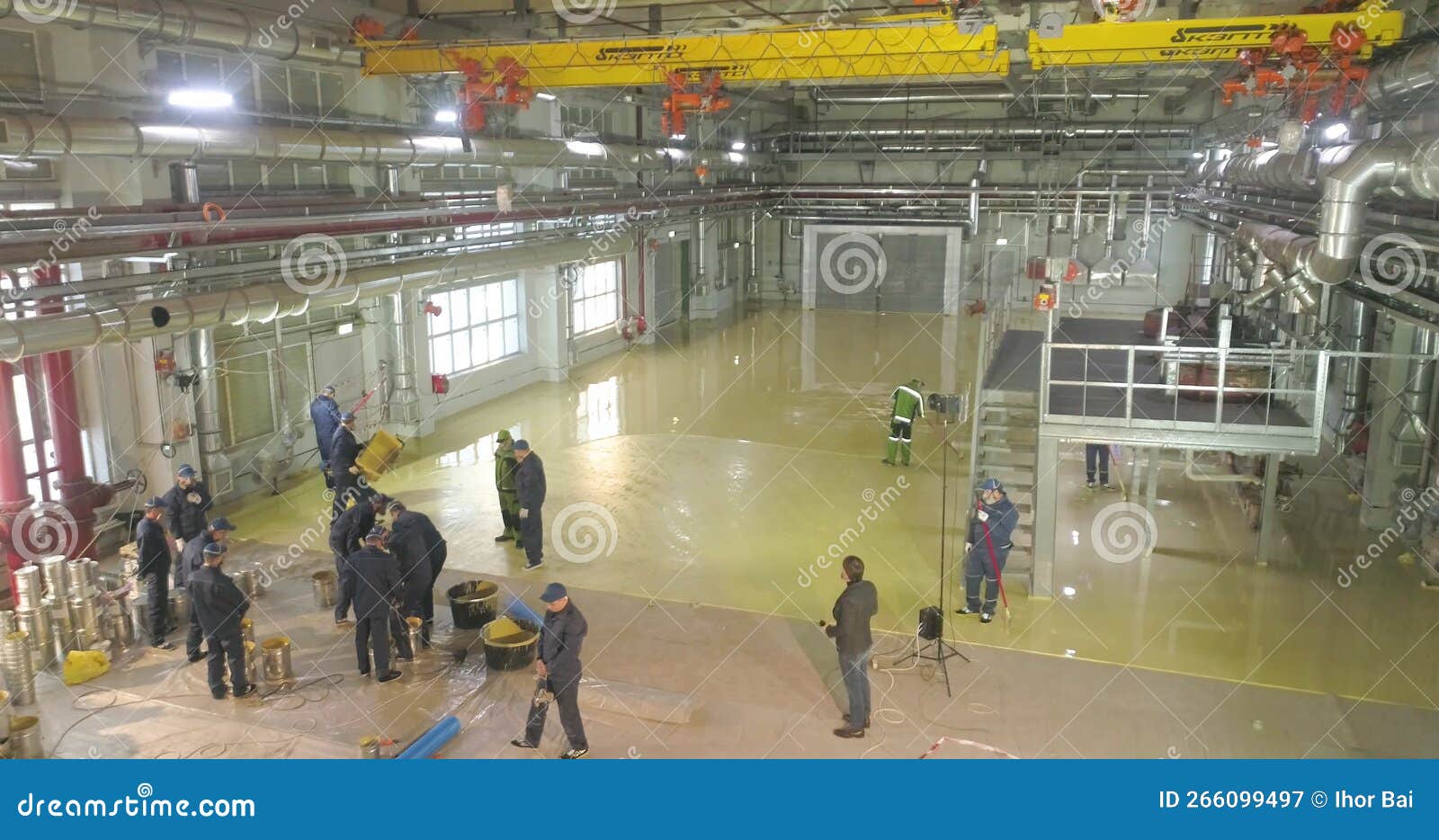Builders Make a Self-leveling Floor in the Factory Workshop. Self ...