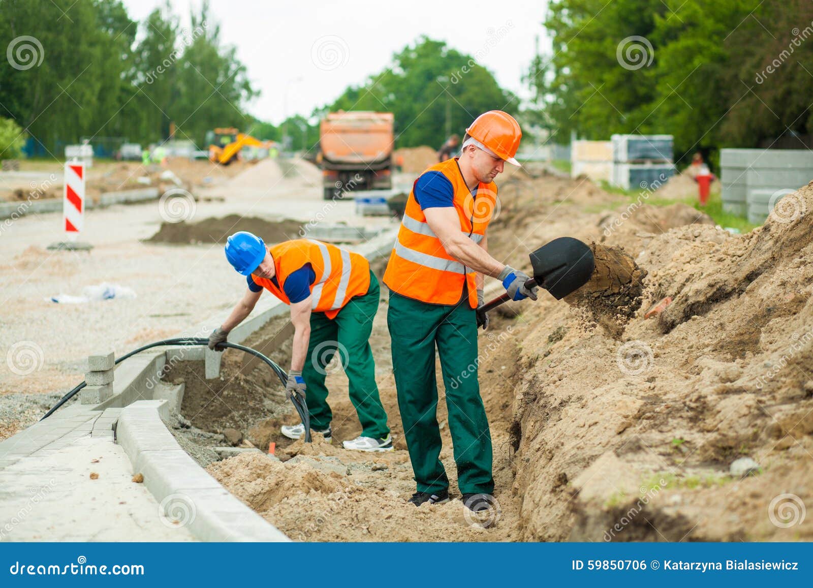 Builders On Site Looking On PLan Blueprint Contractor Explaining ...