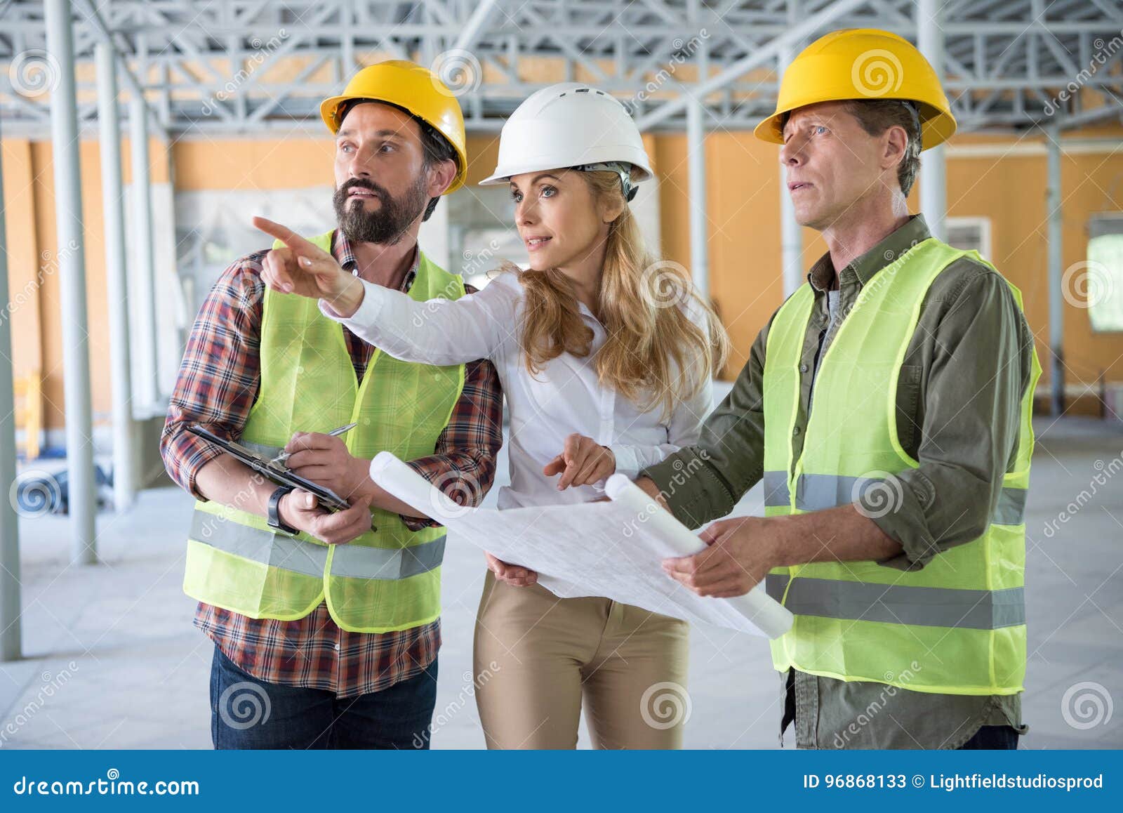 Builders and Contractor Talking during Work on Construction Site Stock ...