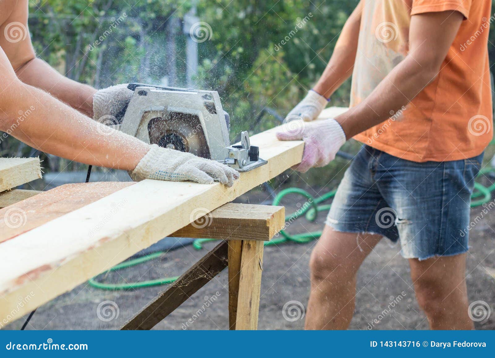 The Builders Cuts the Board with a Circular Saw Stock Photo - Image of ...