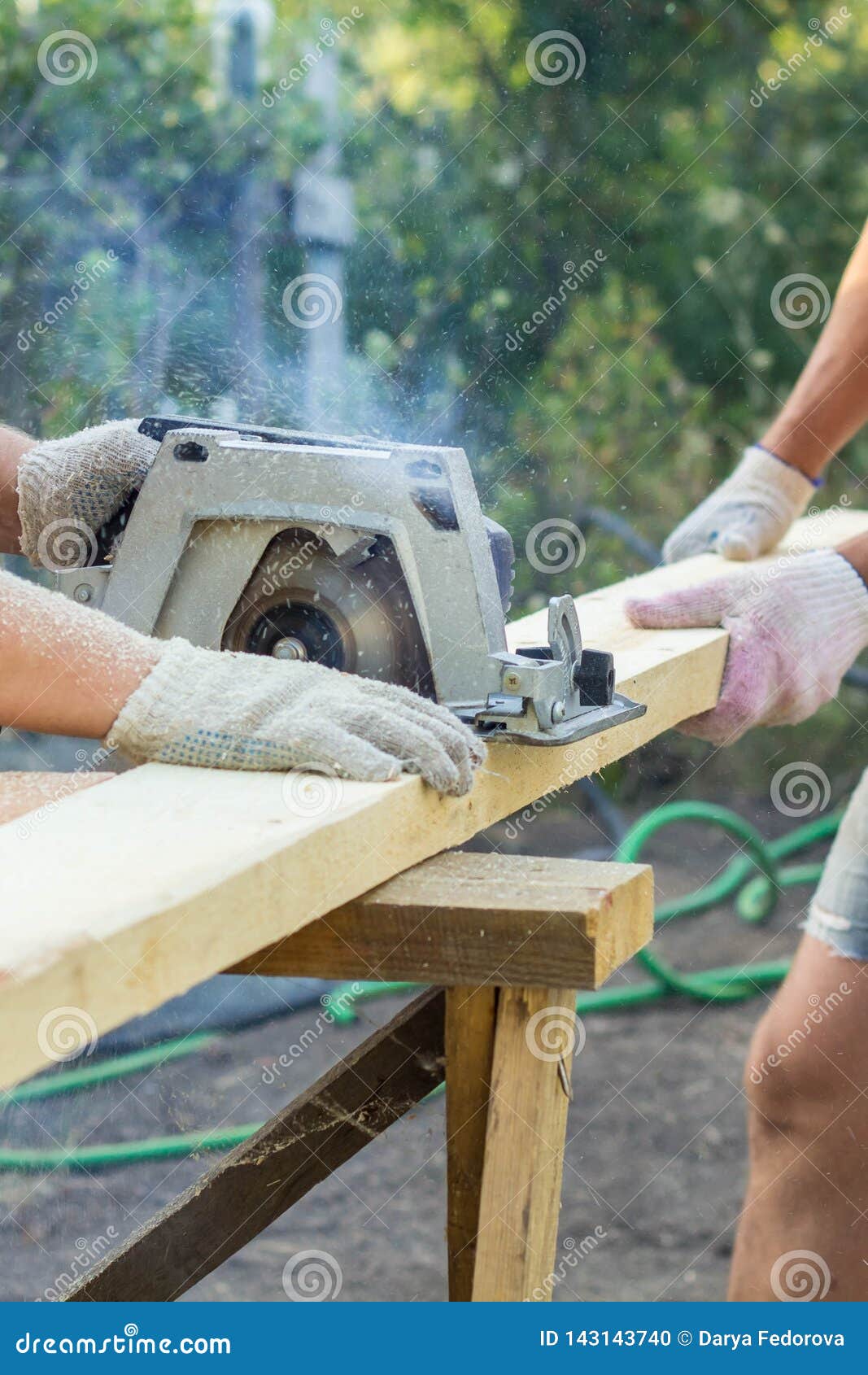 The Builders Cuts the Board with a Circular Saw Stock Photo - Image of ...