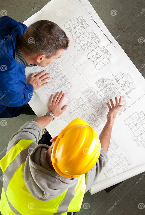 Builders Examine Blueprints Stock Photo - Image of businessman ...